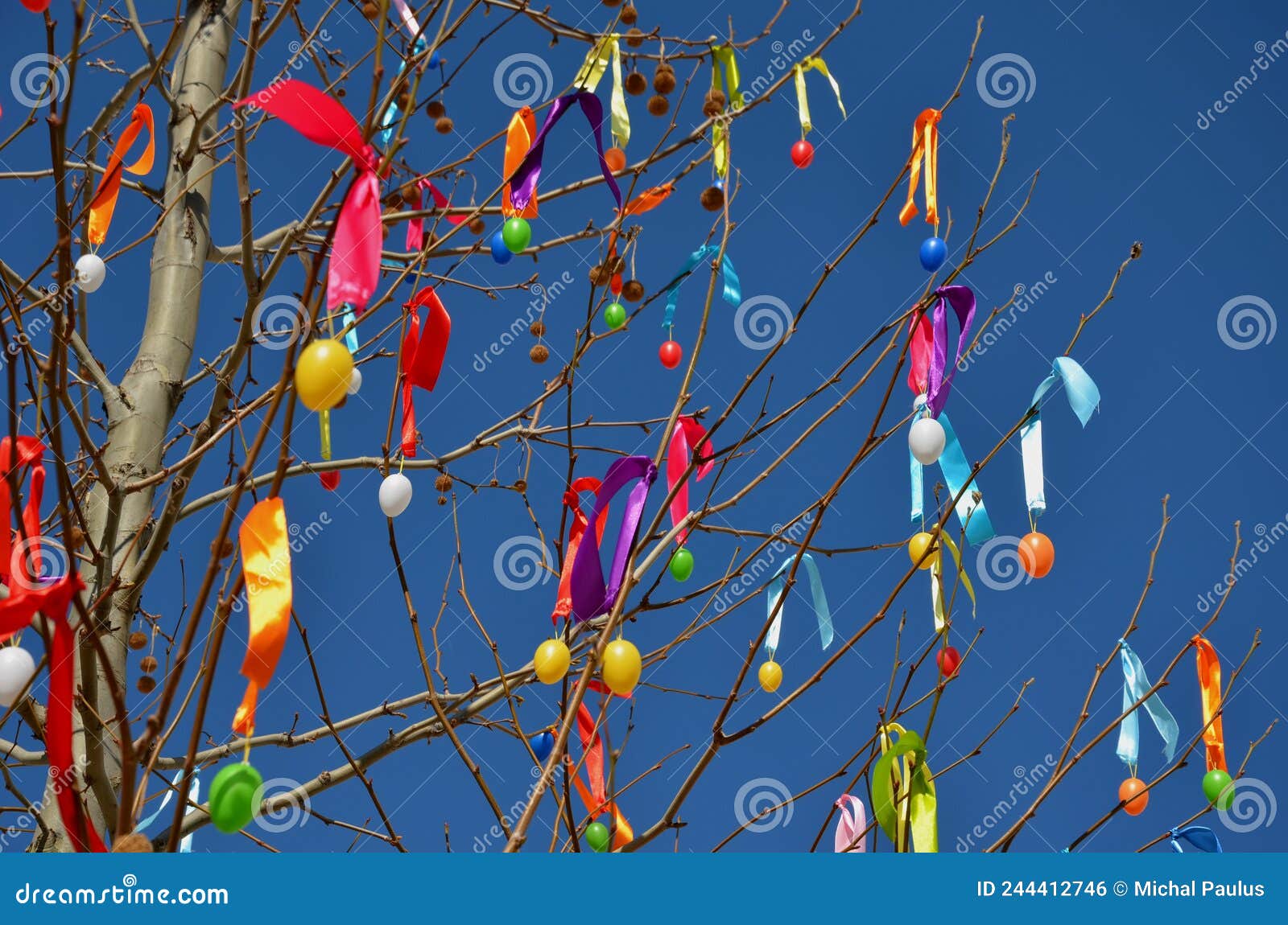 Easter Tree with Plastic Egg Decorations and Colorful Ribbons Hanging ...