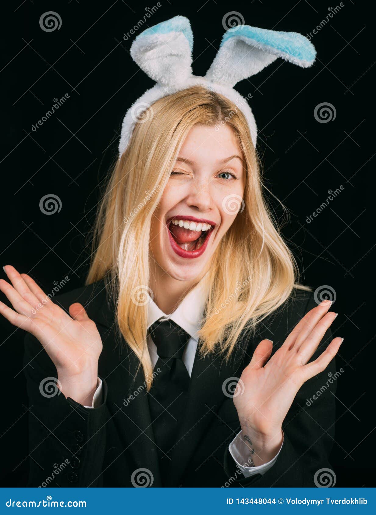 Easter Woman Portrait Of A Happy Woman In Bunny Ears Winking Closeup