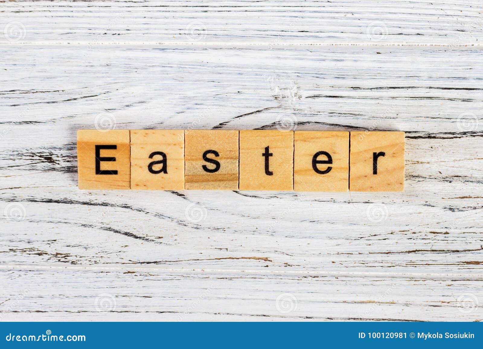 Easter Word in Wooden Cube on the Table Stock Image - Image of ...