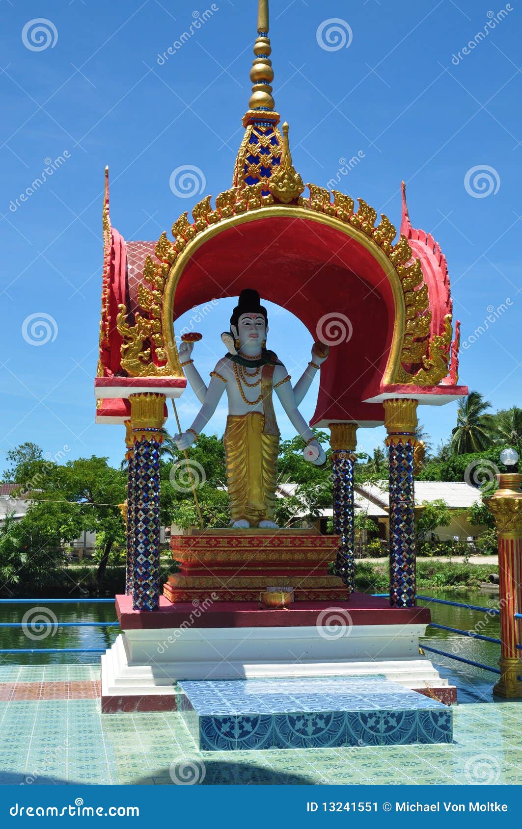 Eastern statue stock image. Image of arms, religion, roof - 13241551
