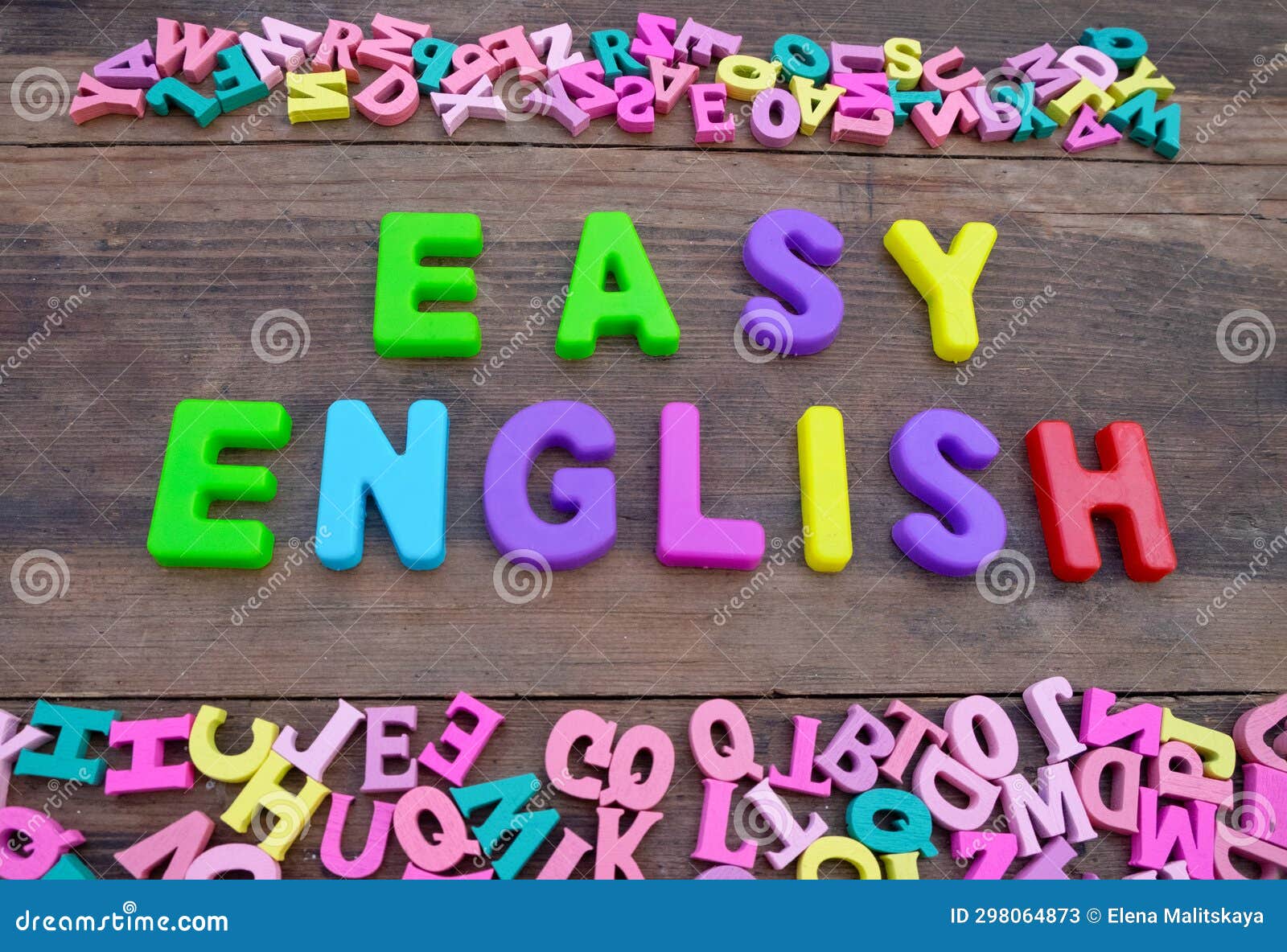 Easy English Phrase on an Wooden Table. Many Plastic Letters of the ...