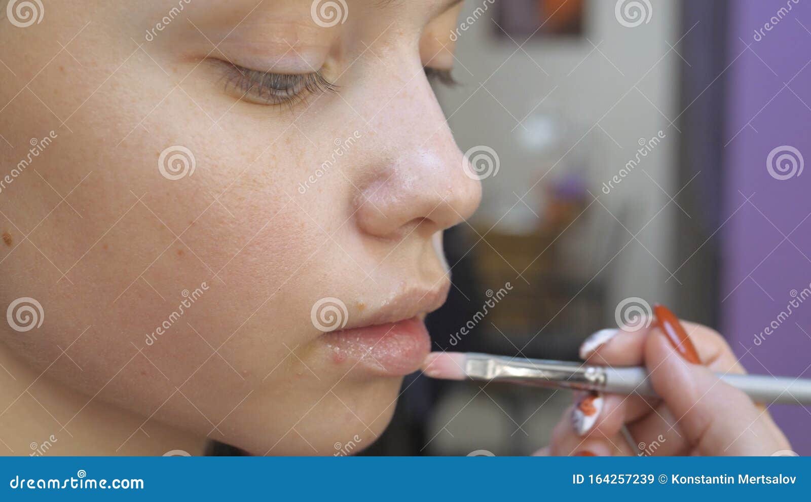 Easy Halloween Makeup. Applying Makeup To the Face. Applying Red Paint ...