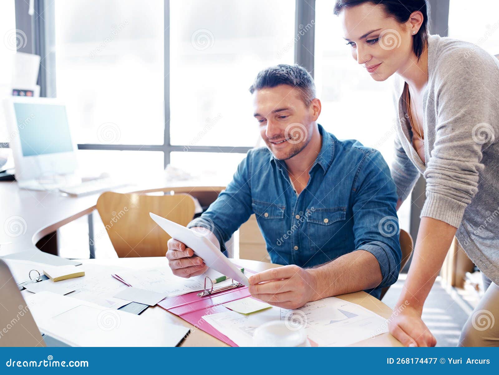The Easy Way To Share Your Ideas. Two Coworkers Using a Tablet in a ...