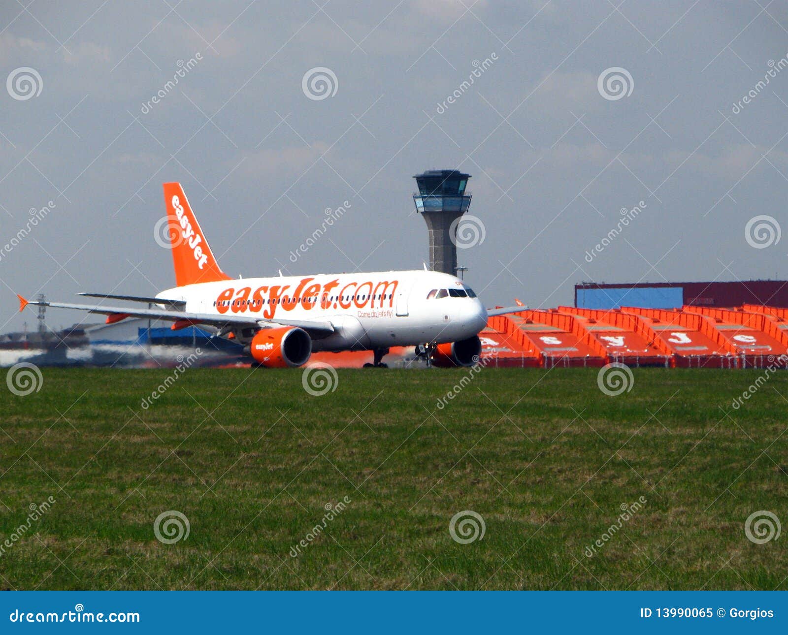 Easyjet and control tower editorial image. Image of cloud - 13990065