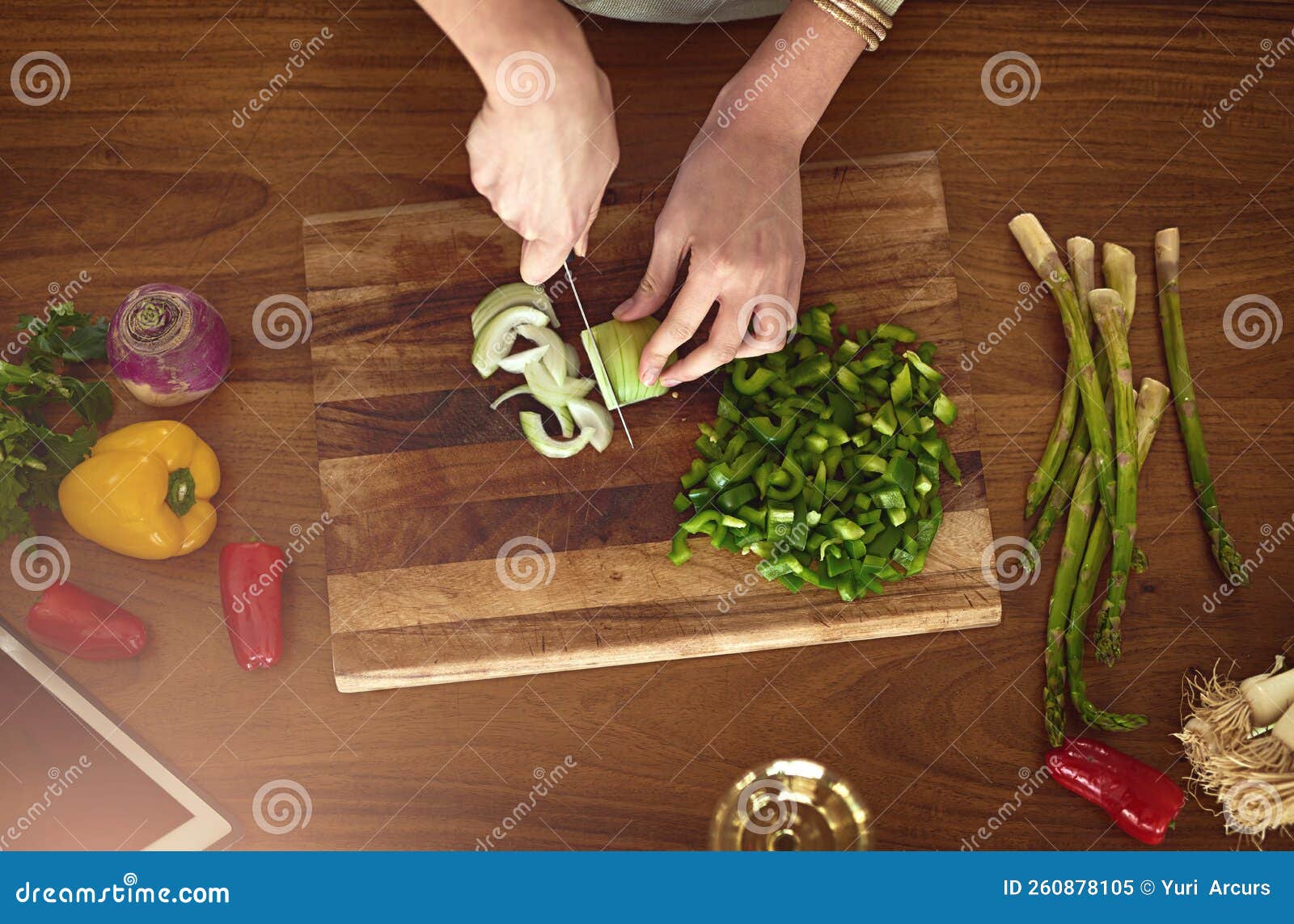 Eat Green, Eat Clean. High Angle Shot of Someone Cooking in the Kitchen ...
