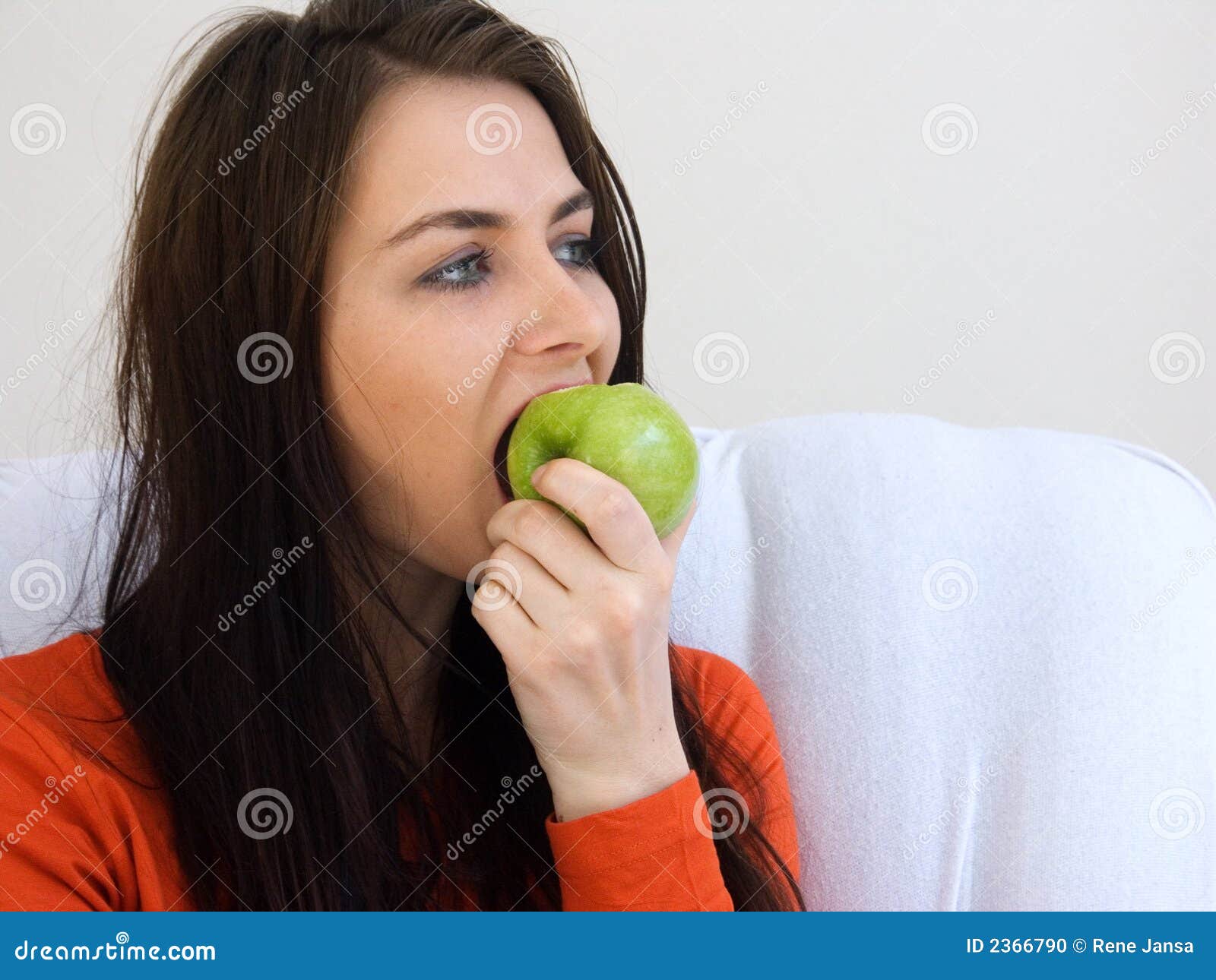 Eating a Apple stock photo. Image of green, bite, snacking - 2366790