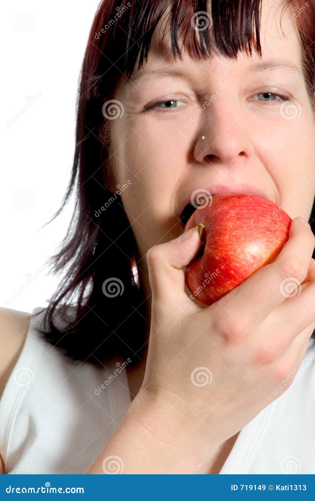 Eating an apple stock image. Image of hold, holding, bite - 719149