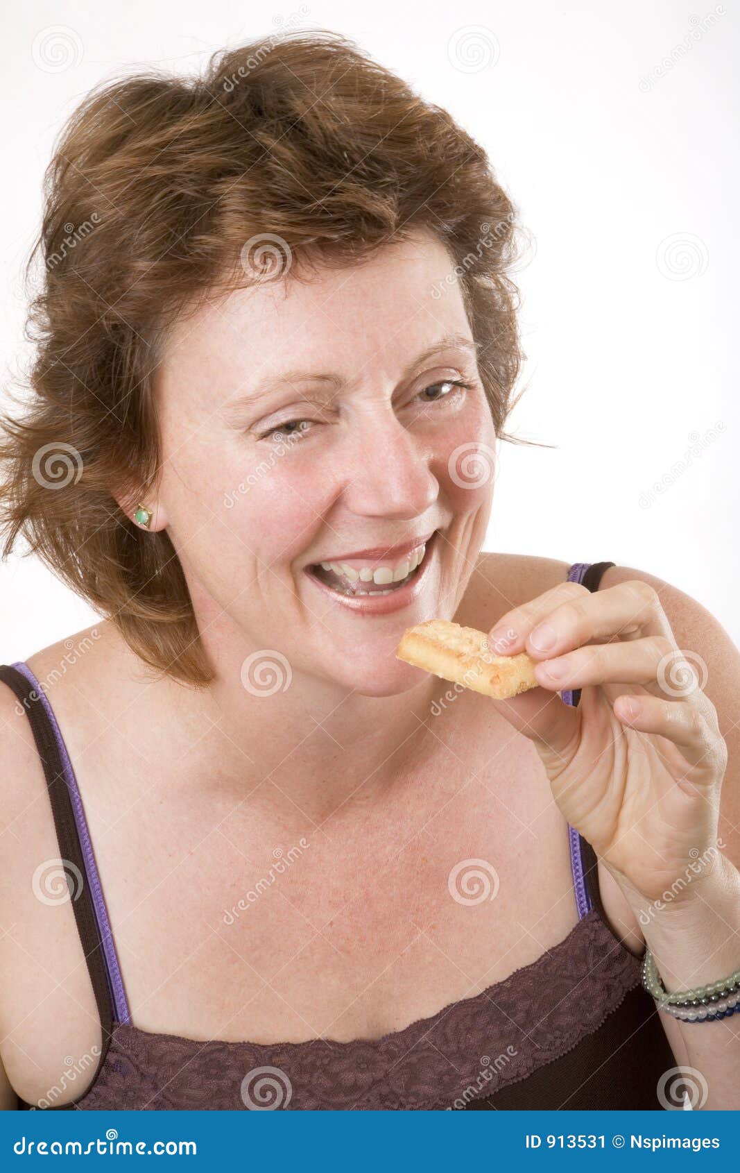 Eating a biscuit stock image. Image of female, laughing - 913531