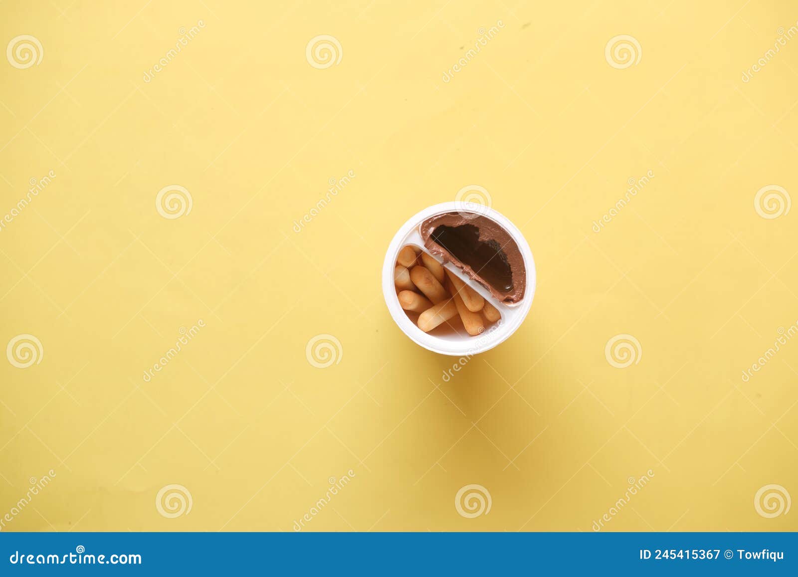 Breadstick with Chocolate Spread Cream in a Container on Yellow ...