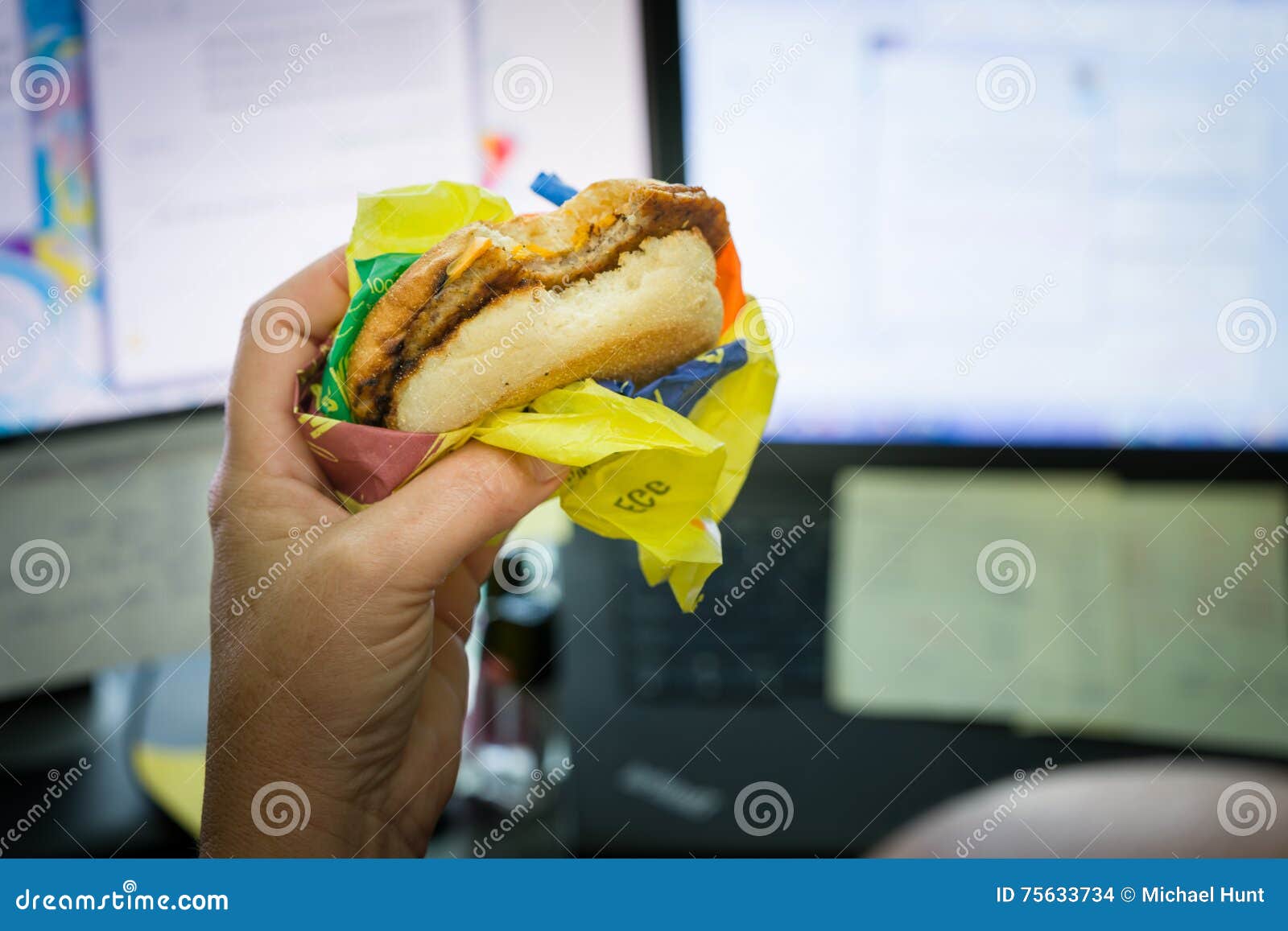 Eating Breakfast at Work in Front of Computer Screen Stock Photo ...
