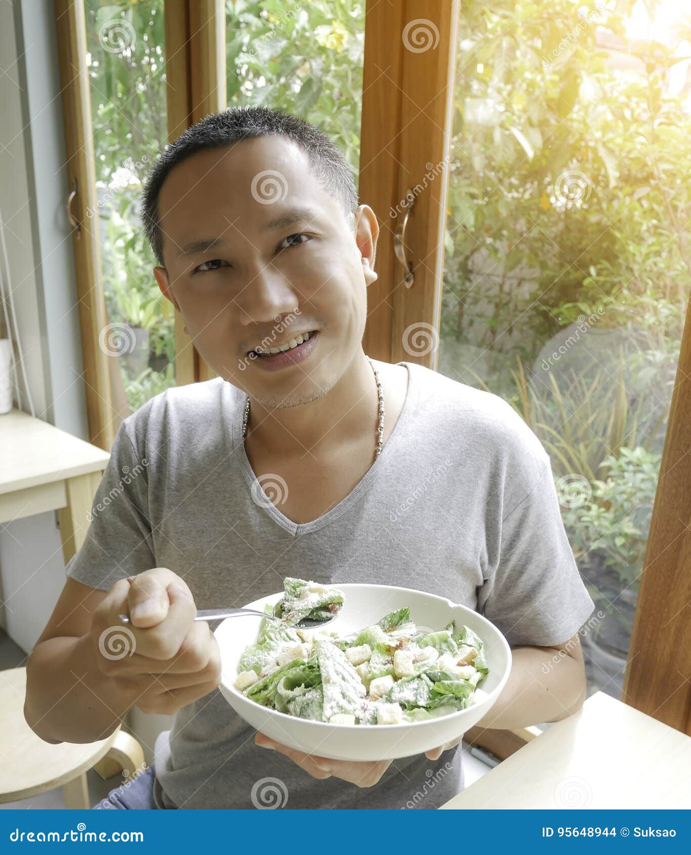 Eating caesar salad stock photo. Image of nutrition, appetizer - 95648944