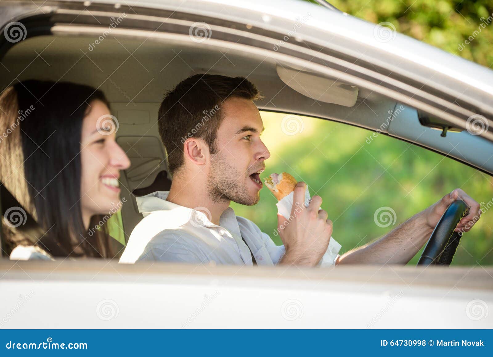 Eating in car stock photo. Image of female, baguette - 64730998