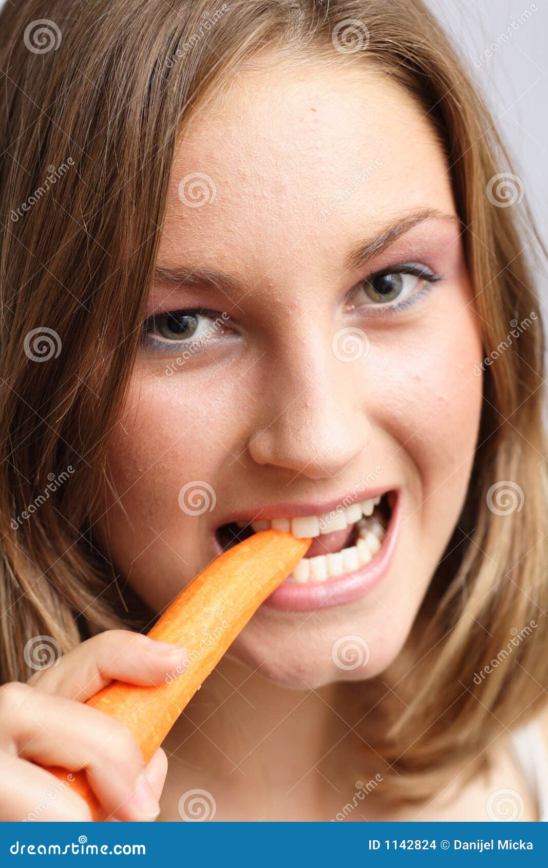 Eating carrot #2 stock photo. Image of holding, carrot - 1142824