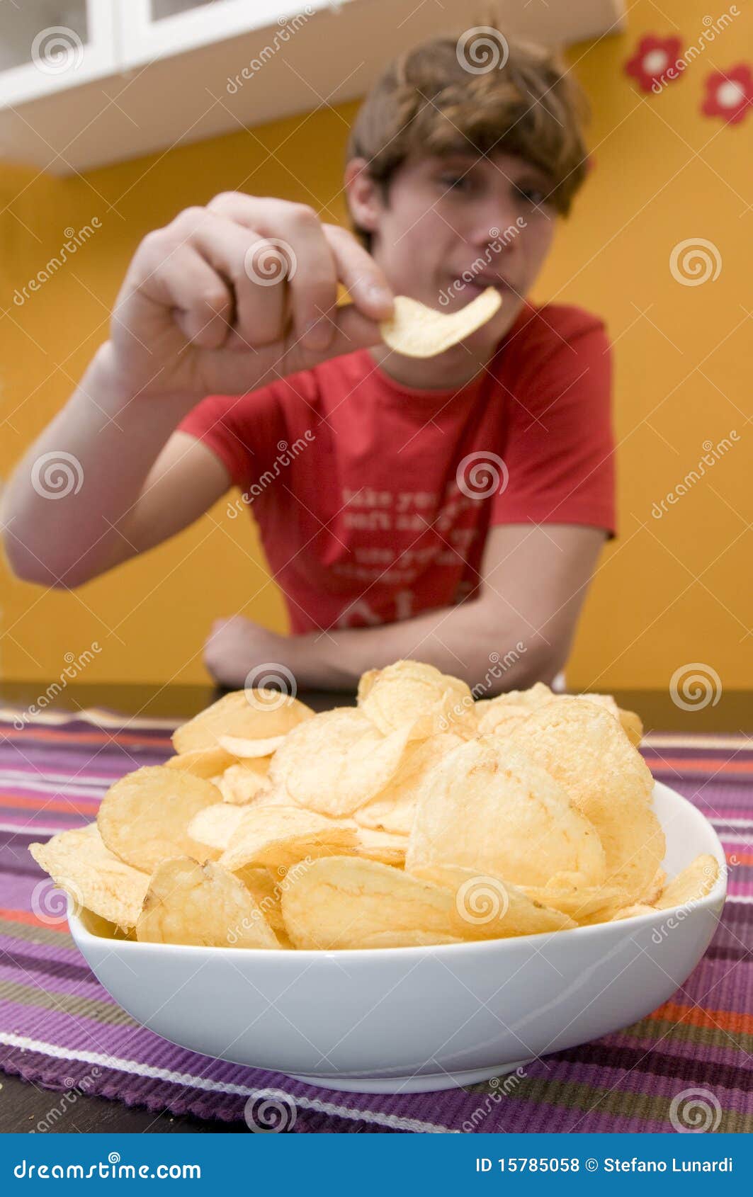 Eating chips stock photo. Image of nutrition, orange - 15785058