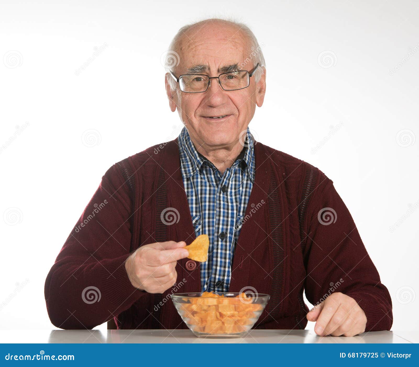 Eating chips stock image. Image of sitting, adult, eating - 68179725