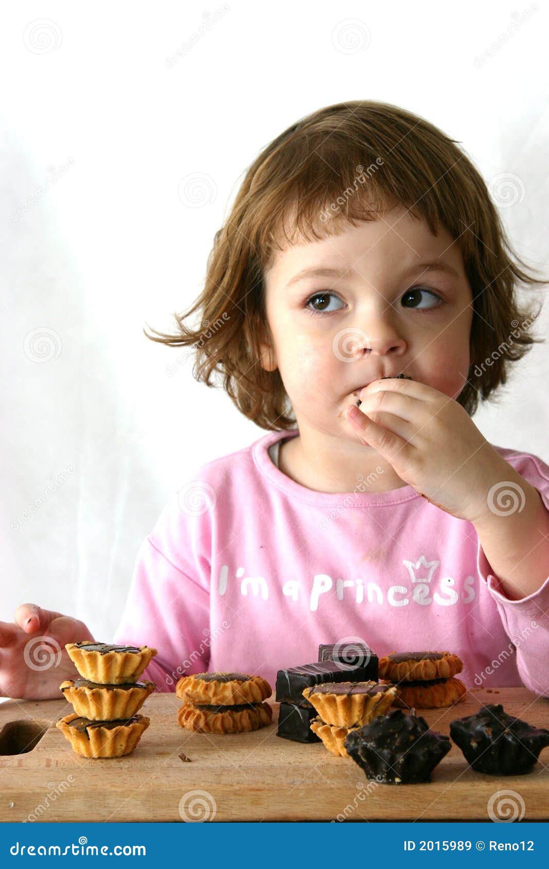 Eating chocolate cakes stock image. Image of cookies, sweet - 2015989
