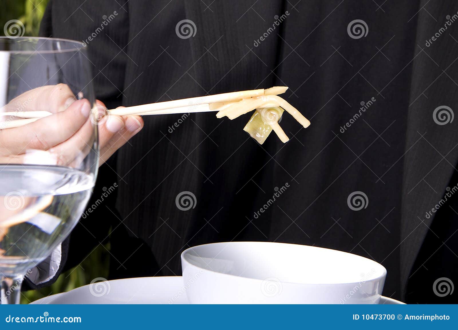 Eating with chop sticks stock photo. Image of adults - 10473700