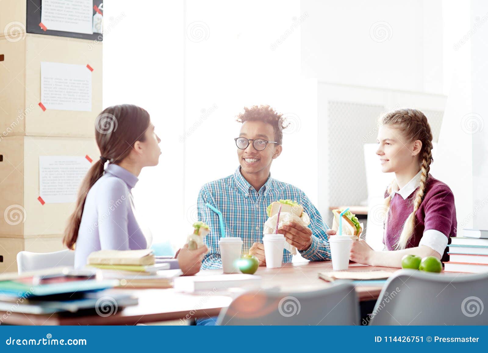 Eating between classes stock image. Image of sandwich - 114426751