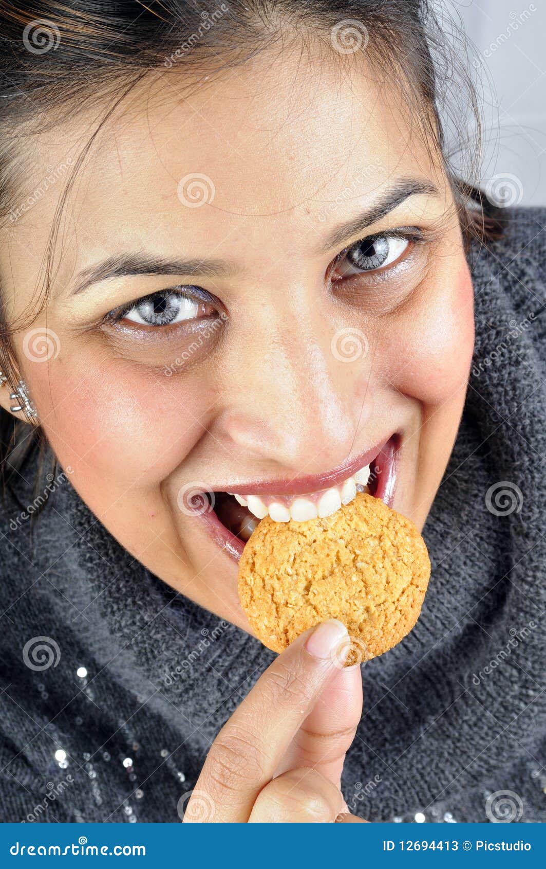 Eating cookie stock image. Image of model, cookie, asian - 12694413