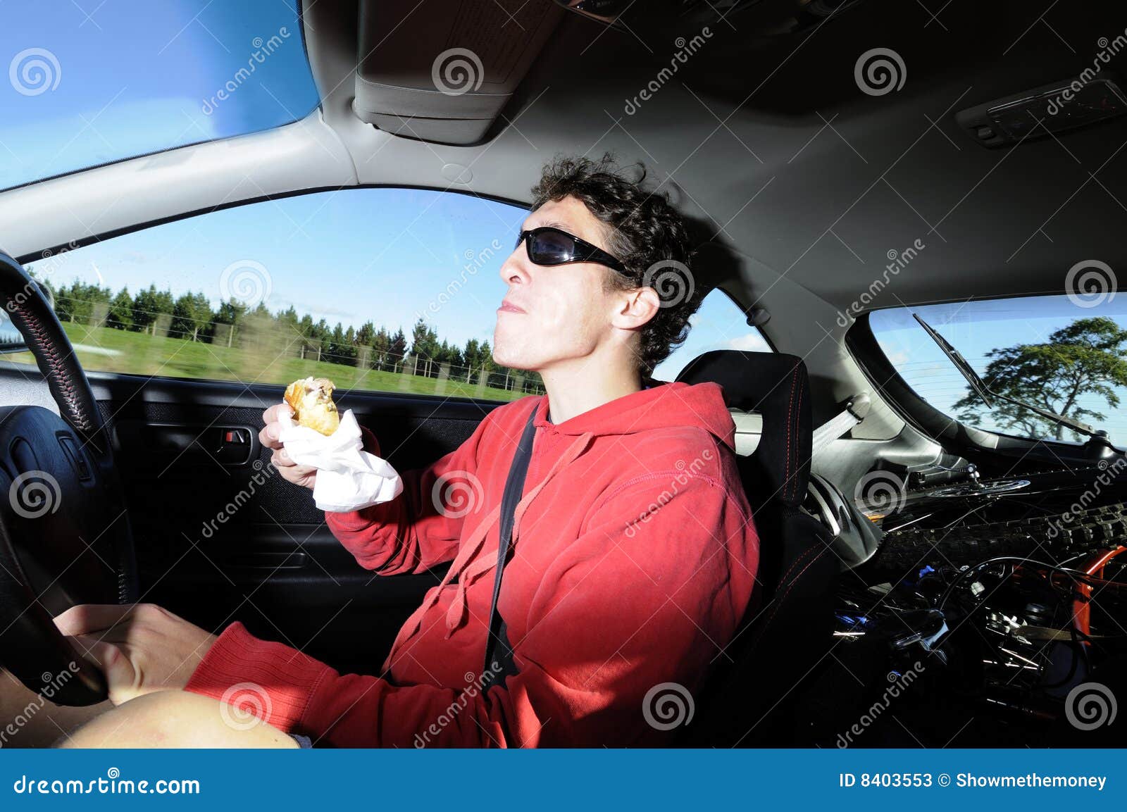 Eating and driving stock image. Image of steering, wheel - 8403553
