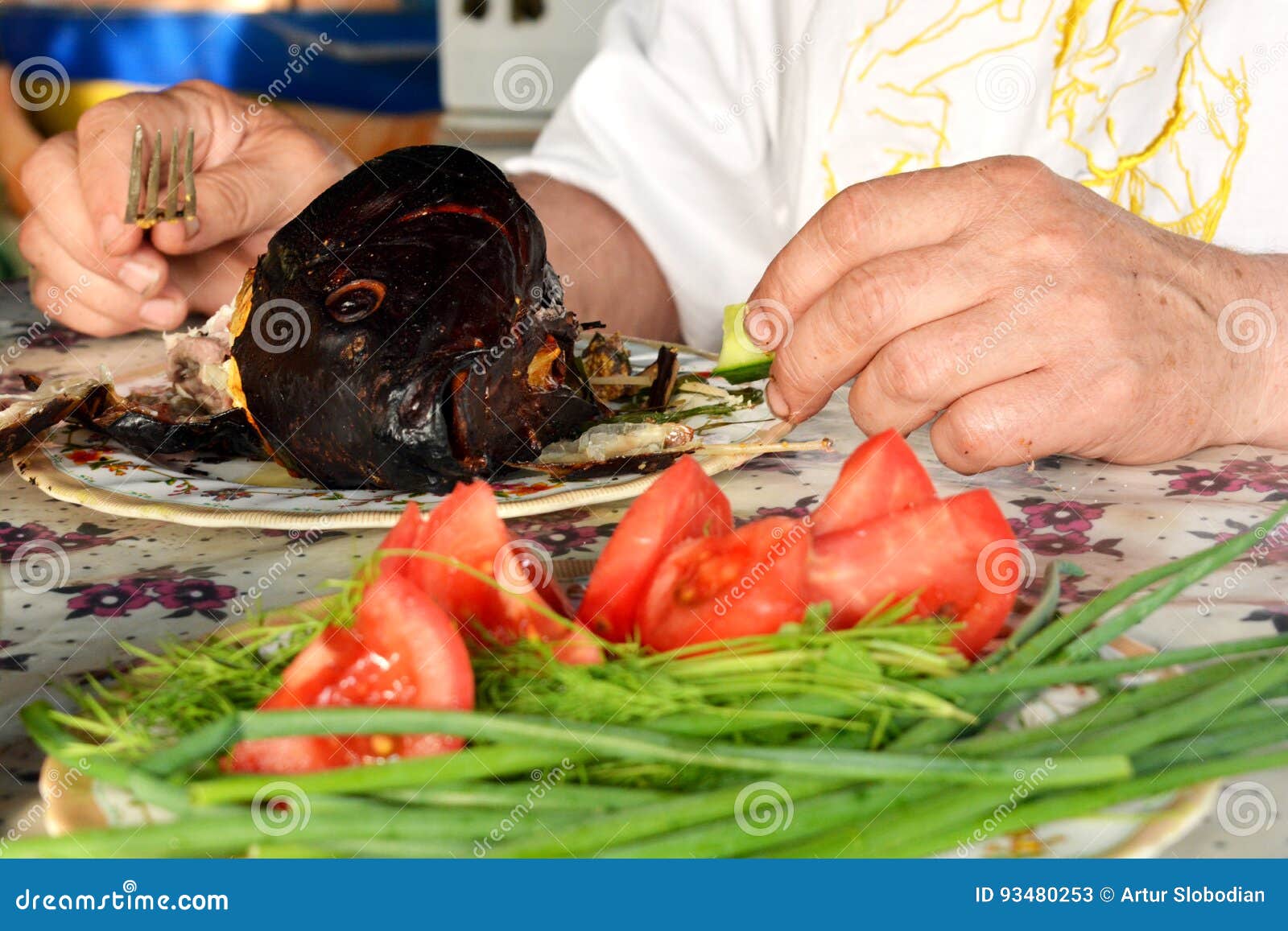 Eating fish head salad stock image. Image of fish, head - 93480253