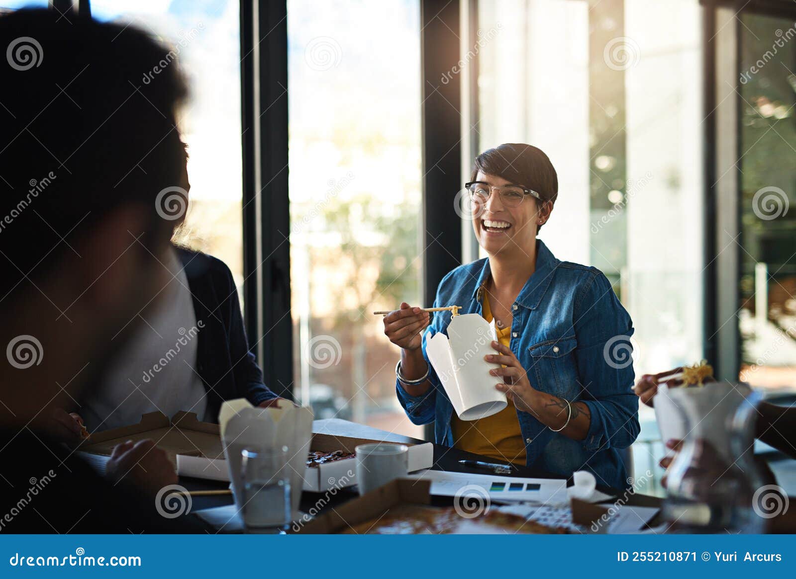 Eating in the Meeting. a Group of Colleagues Eating while Having a ...
