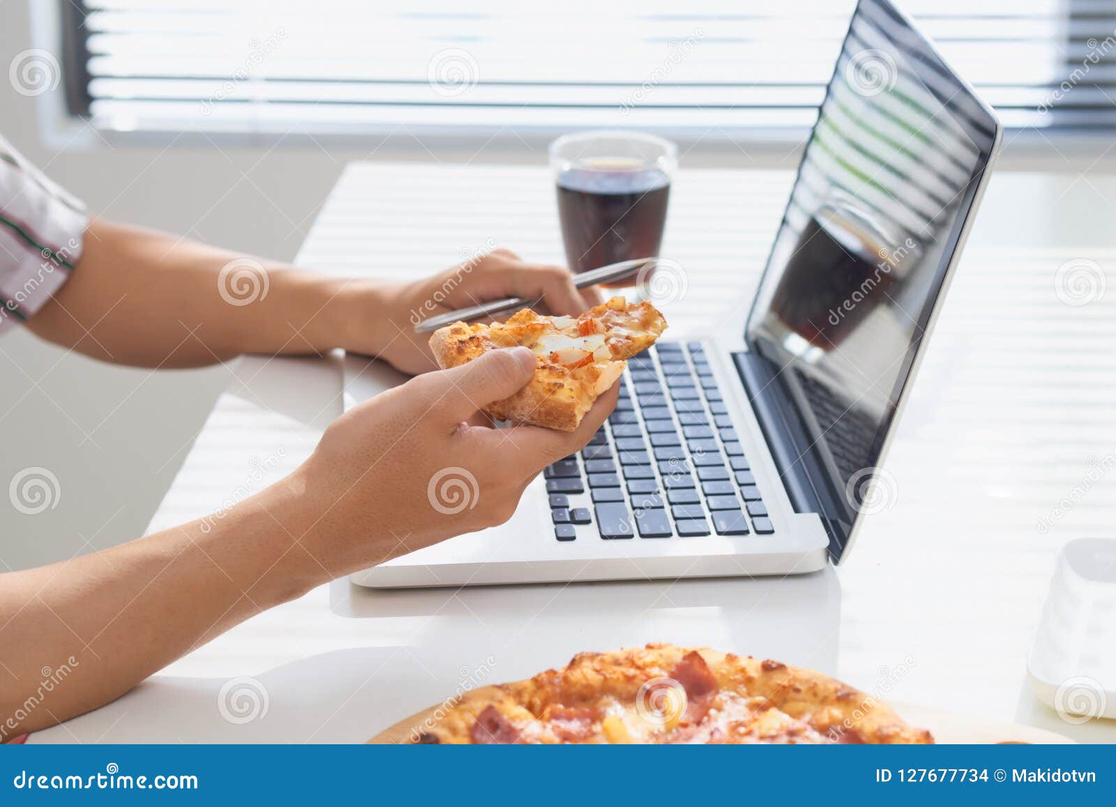 Eating Pizza and Social Networking with a Laptop. Stock Photo - Image ...