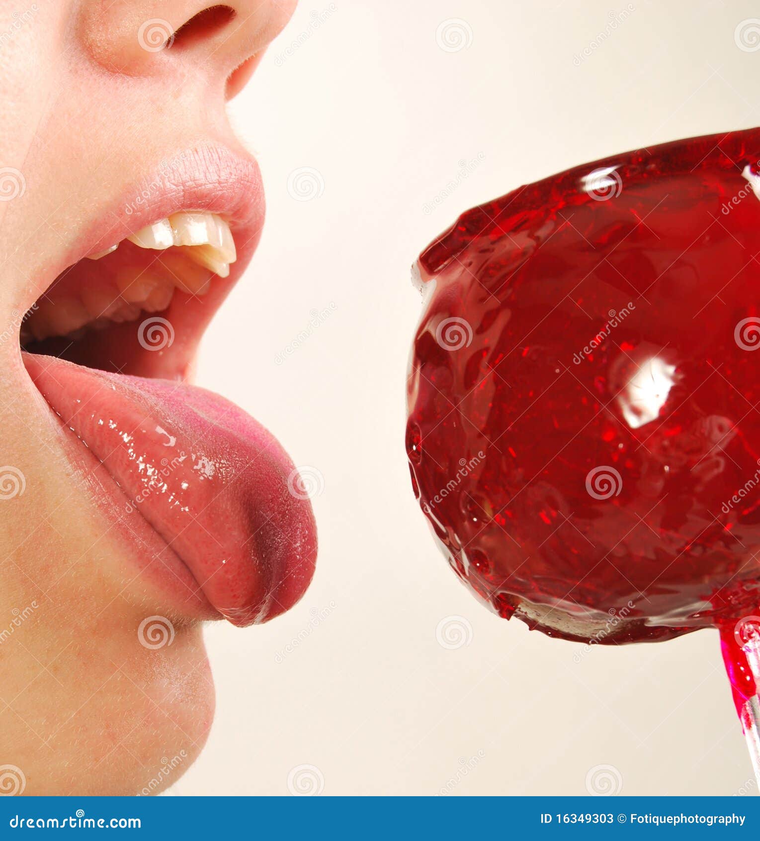 Eating red toffee apple stock image. Image of candy, toffee - 16349303