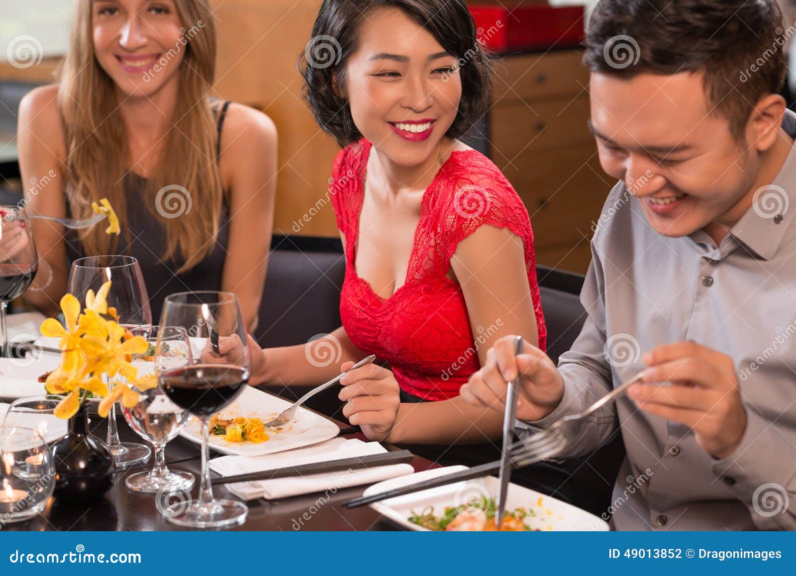 Eating a restaurant stock photo. Image of smiling, table - 49013852