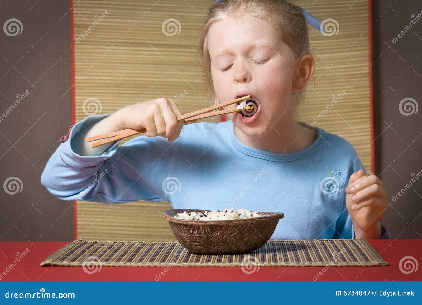 Eating rice stock image. Image of tasting, sticks, blouse - 5784047
