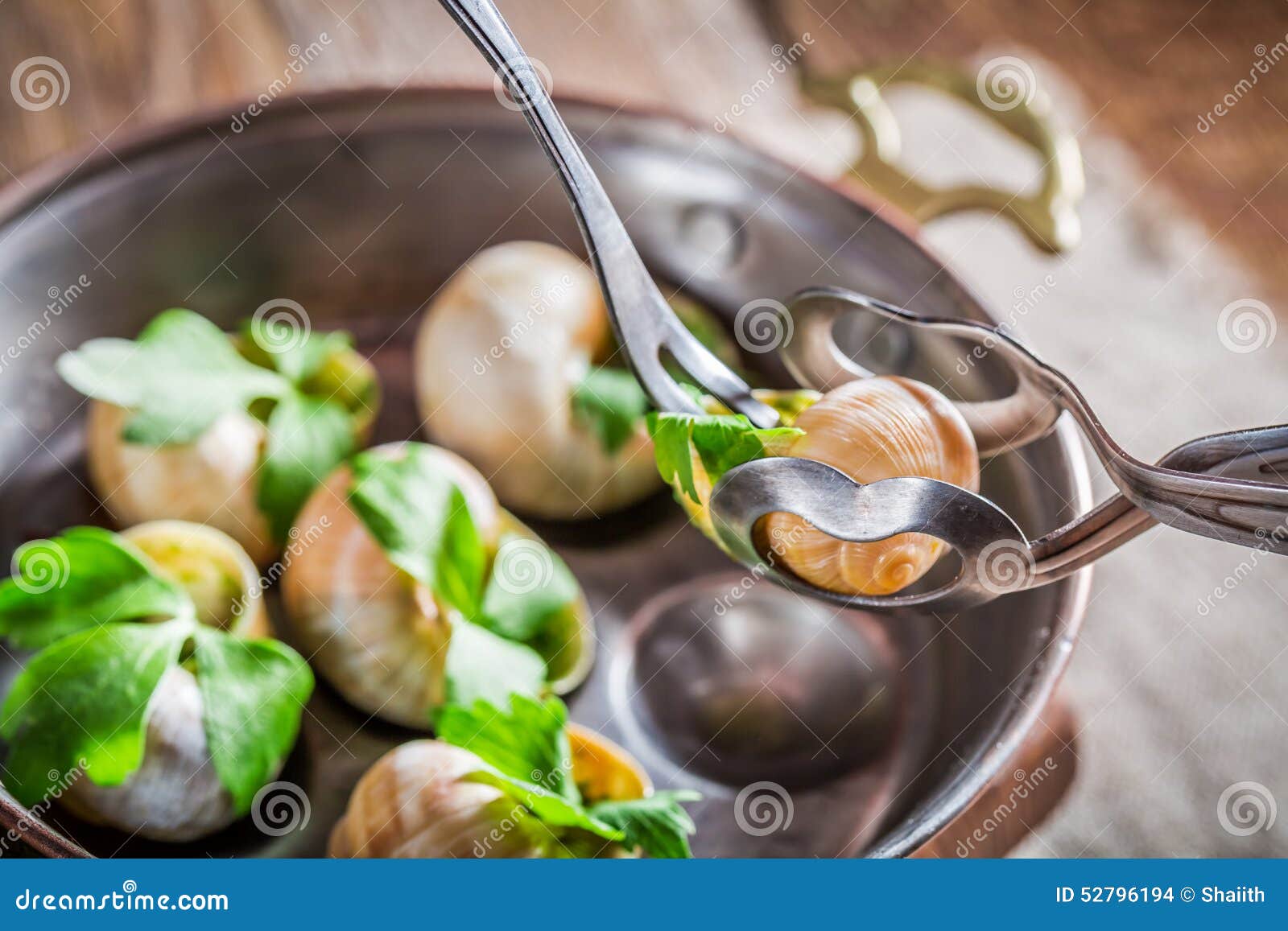 Eating roasted snails stock photo. Image of restaurant - 52796194