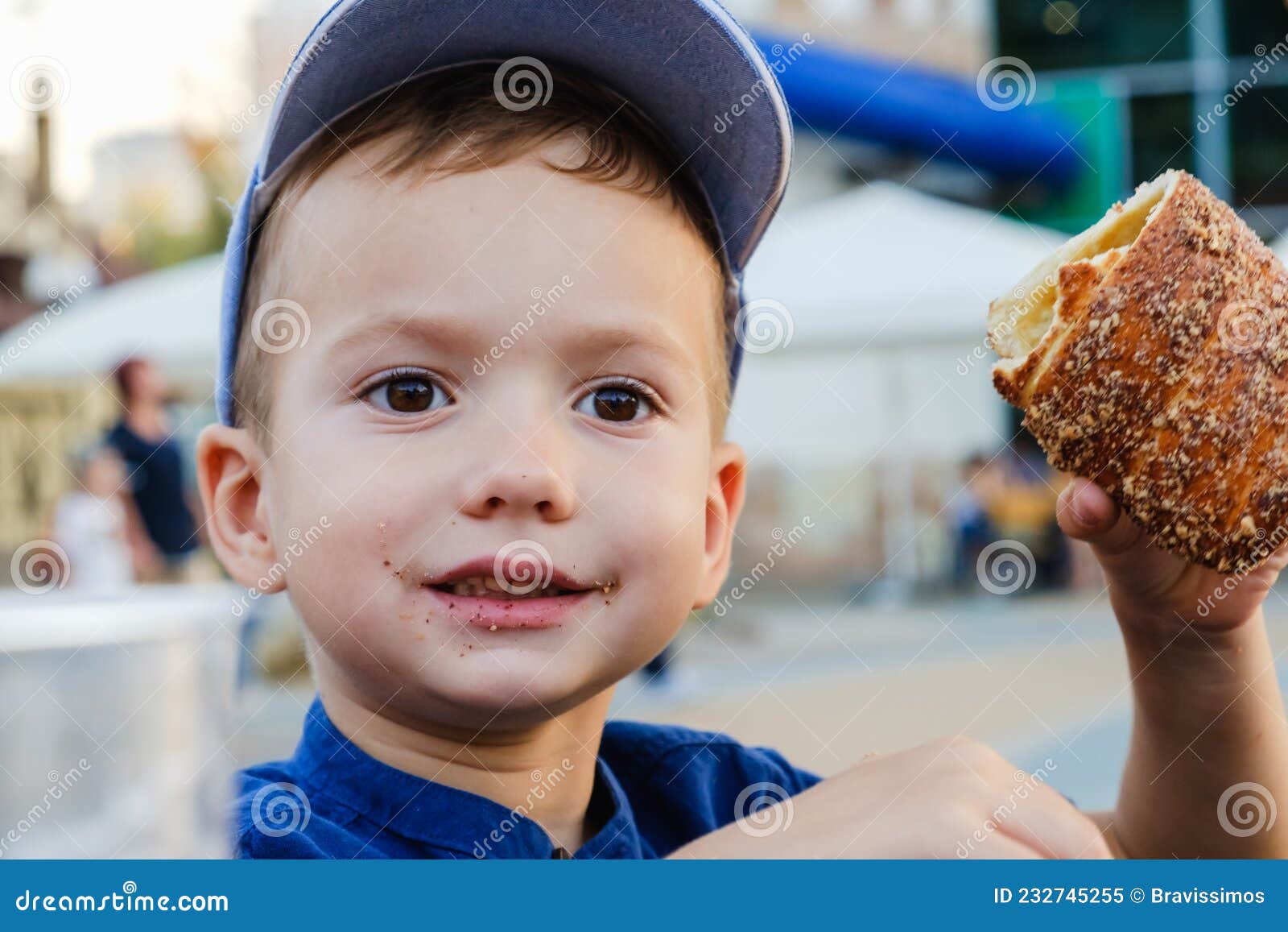 Eating the Roll is a Real Pleasure for Boy. Weekend, Child in Park ...