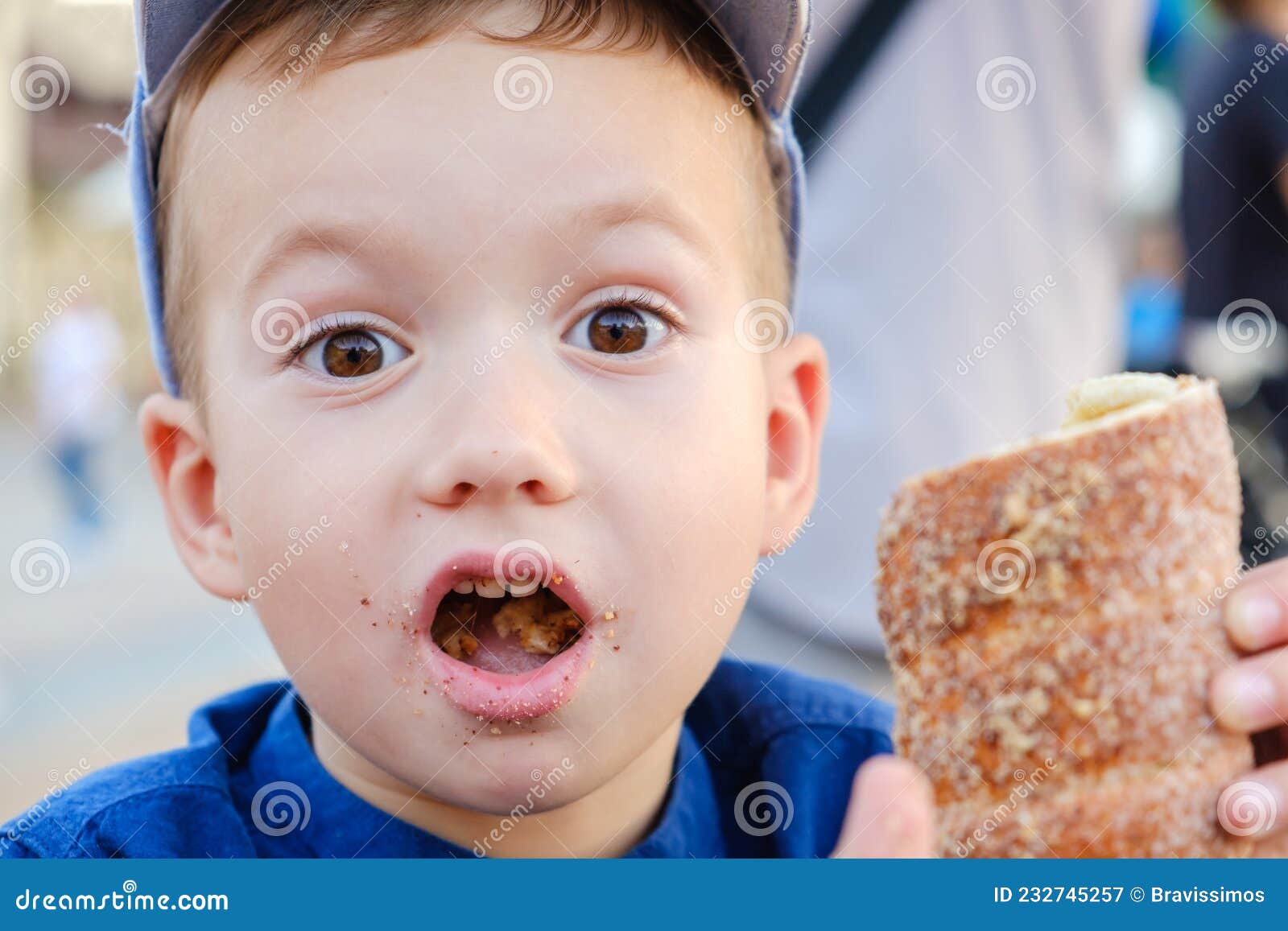 Eating the Roll is a Real Pleasure for Boy. Weekend, Child in Park ...