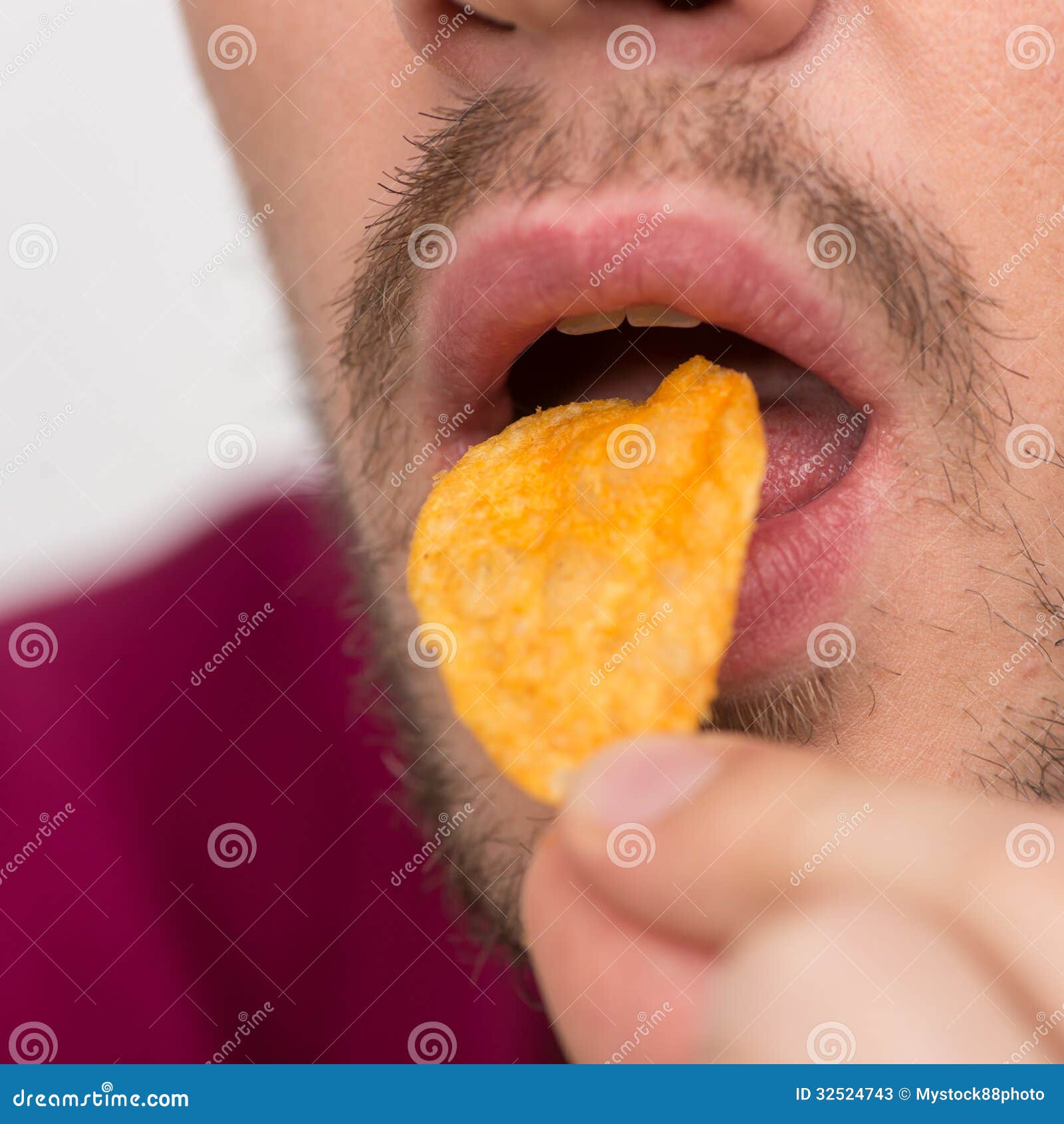 Eating Snacks. Close-up of Men Eating Potato Chip Stock Image - Image ...