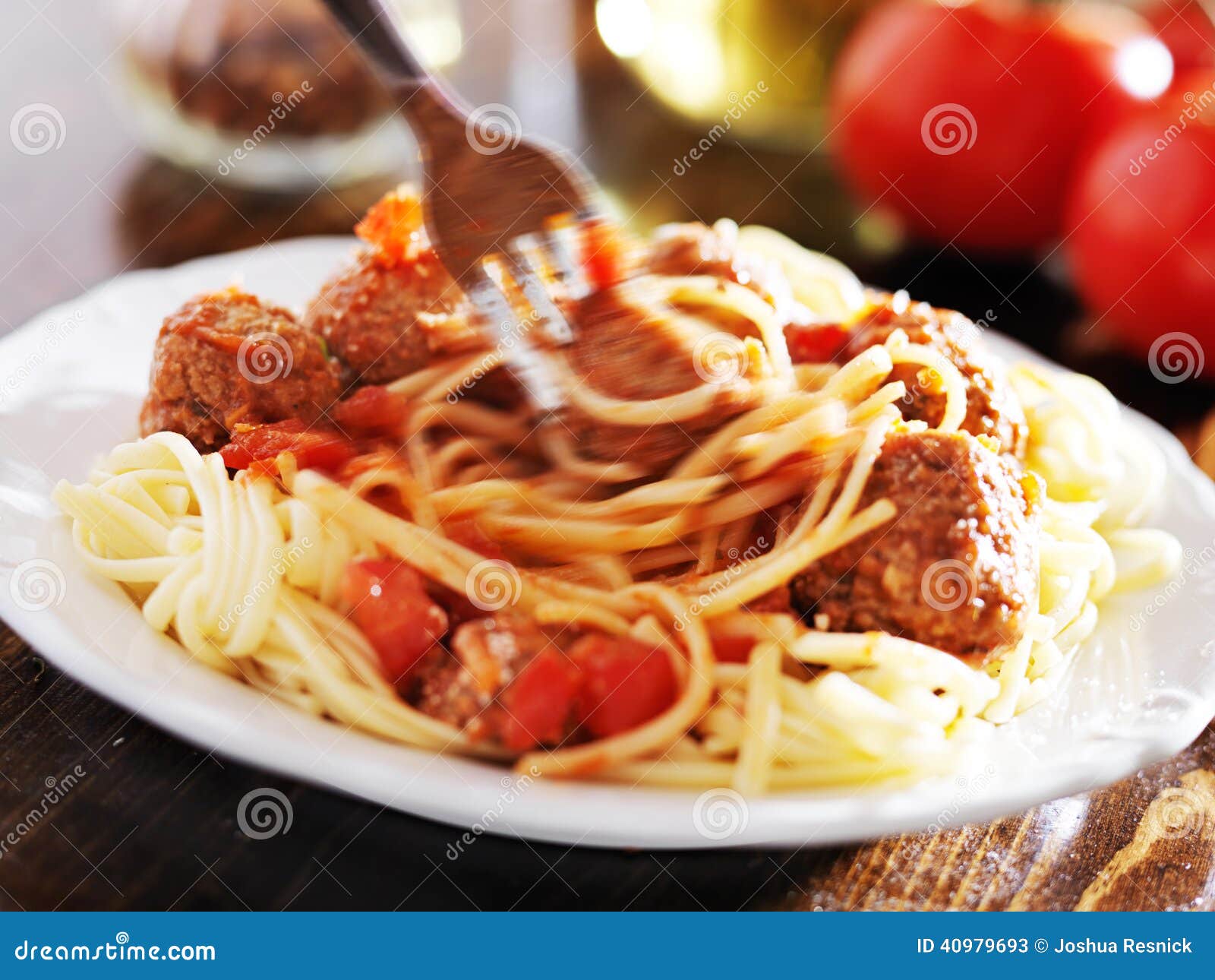 Eating Spaghetti and Meatballs with Visable Motion Blur Stock Image ...