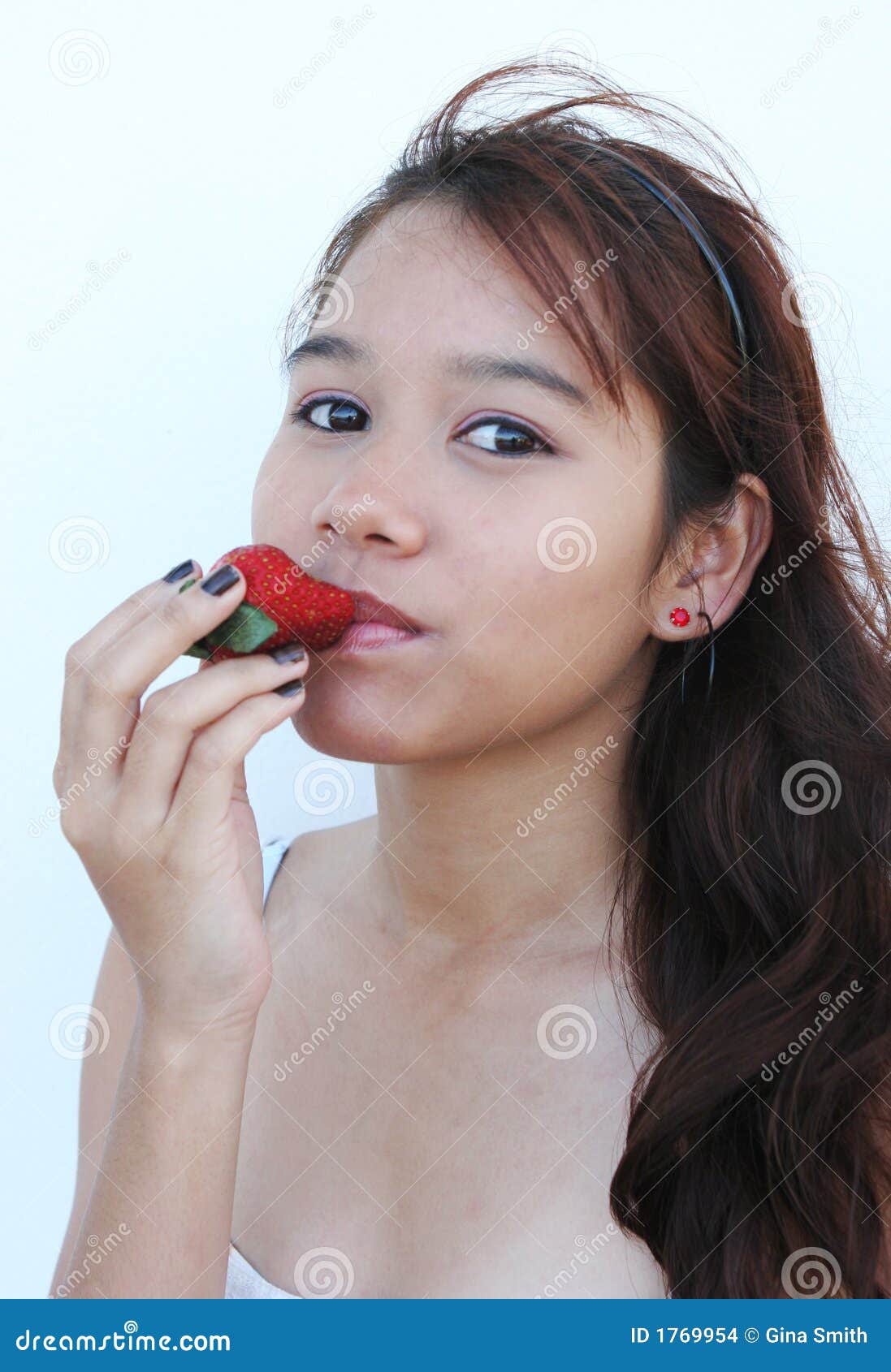 Eating a strawberry stock photo. Image of people, fashion - 1769954