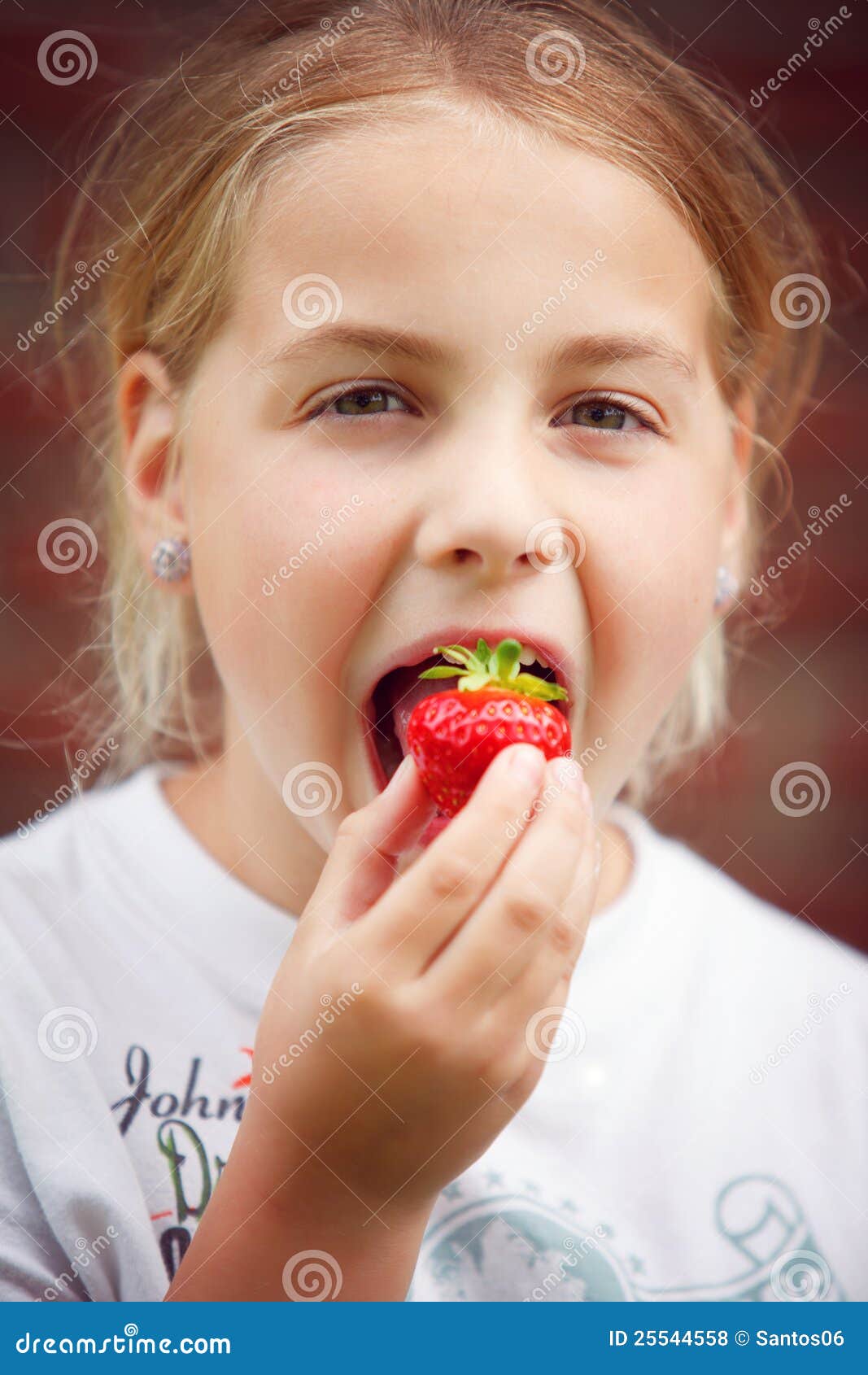 Eating a strawberry stock photo. Image of bright, healthy - 25544558