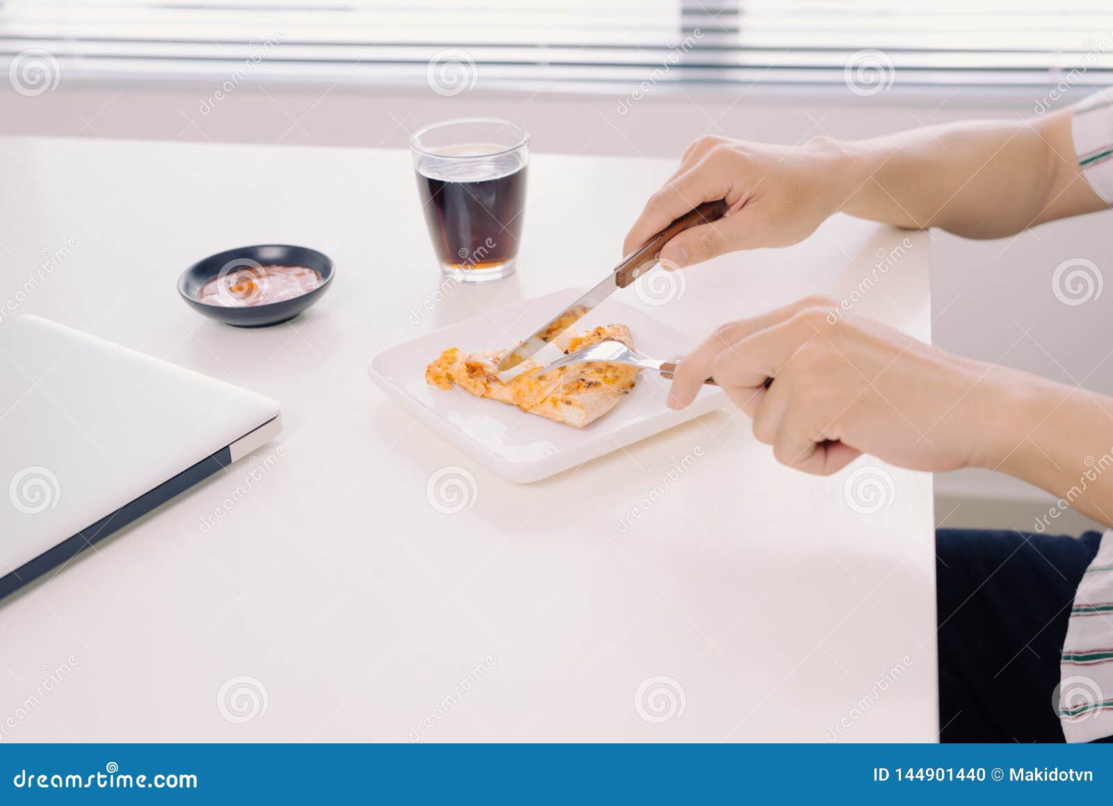 Eating Tasty Pizza on Working Table at Office Stock Photo - Image of ...