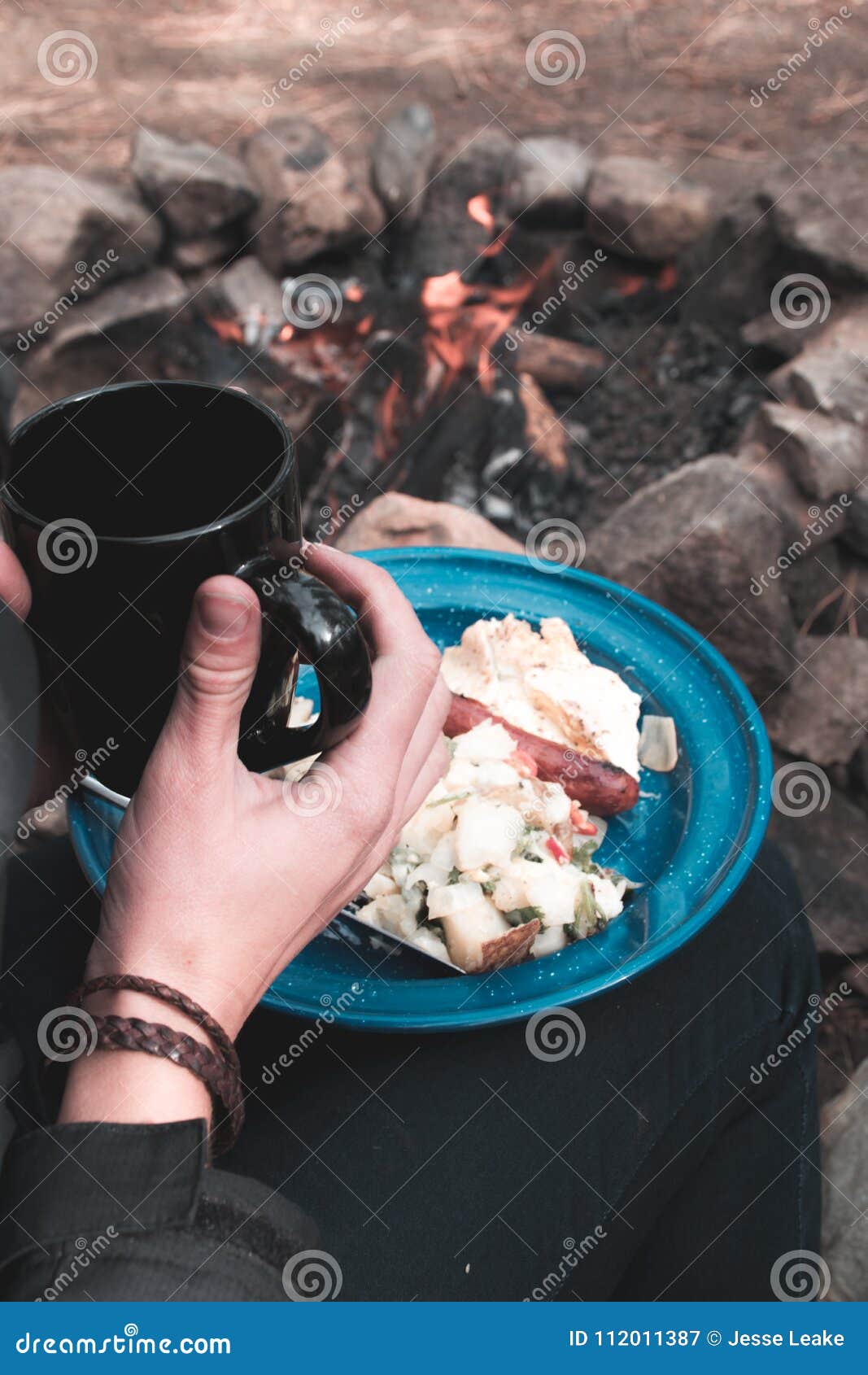 Eating a Warm Fire Cooked Breakfast while Drinking Coffee and Camping ...
