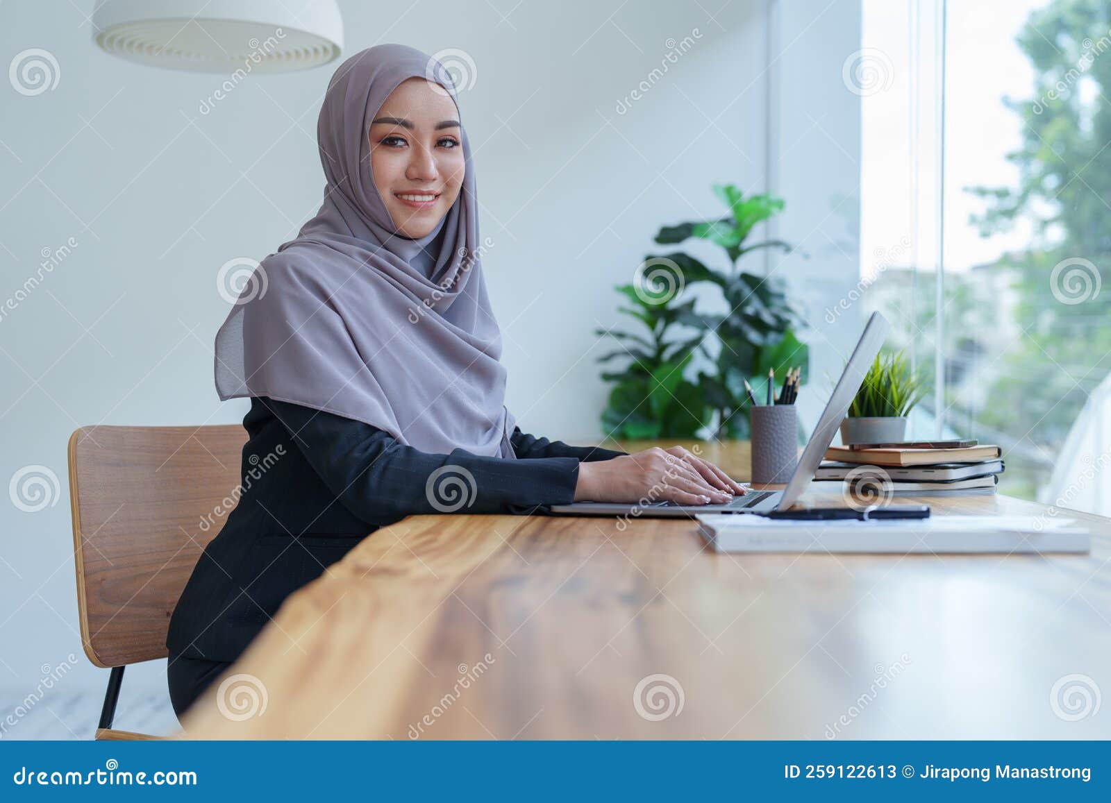 Eautiful Muslim Woman Using Computer and Documents Working in Office ...
