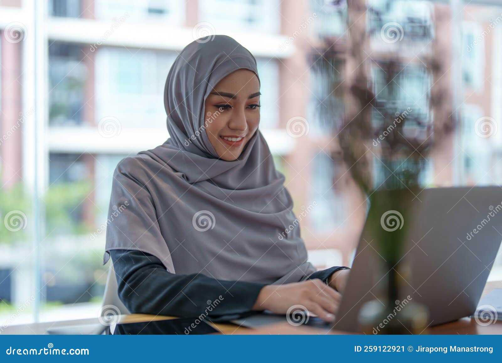 Eautiful Muslim Woman Using Computer and Documents Working in Office ...