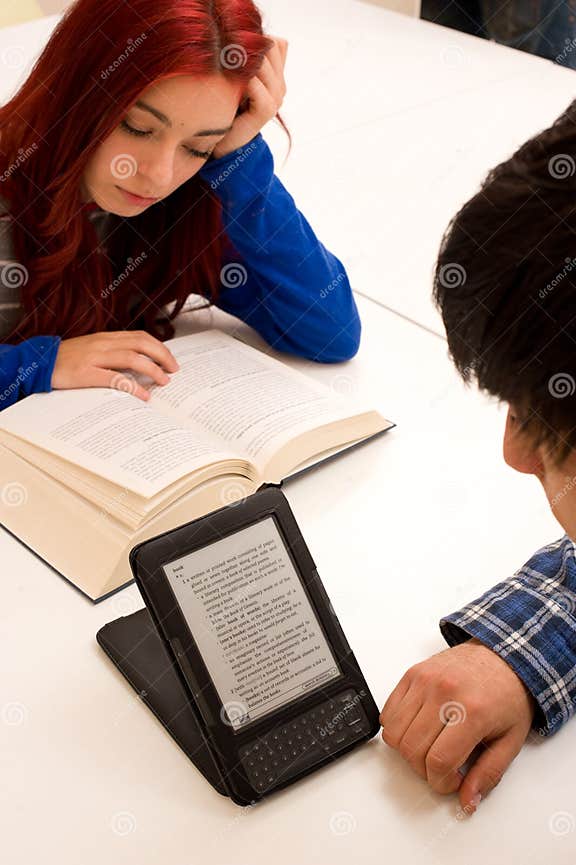 Ebook vs. paper book stock image. Image of ereader, desk - 24375759