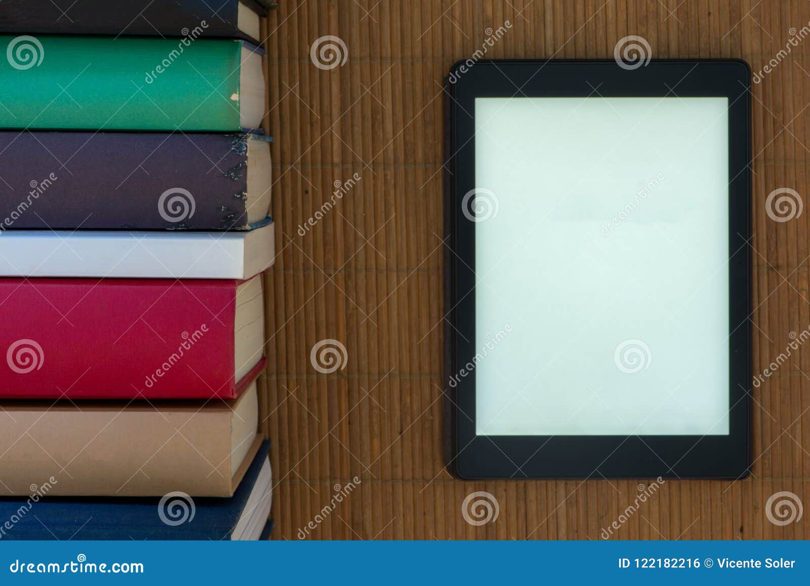 An Ebook with the White Screen Surrounded by Books Stock Photo - Image ...