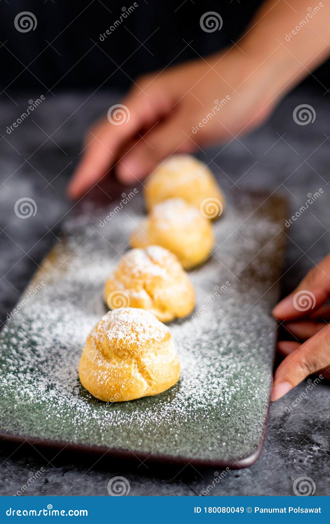 Eclair, Choux Filled Vanilla Custard Cream and Dusted with Icing Stock ...