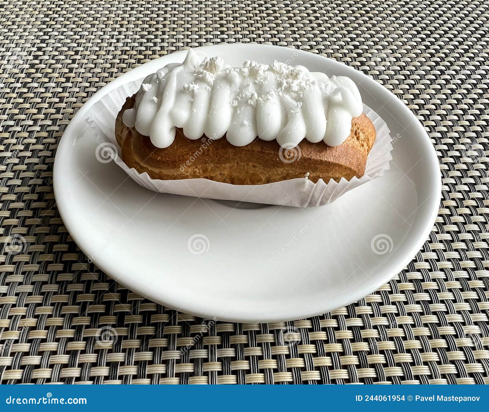 Eclair With Cream Halved On A Black Background In Icing Sugar Royalty ...