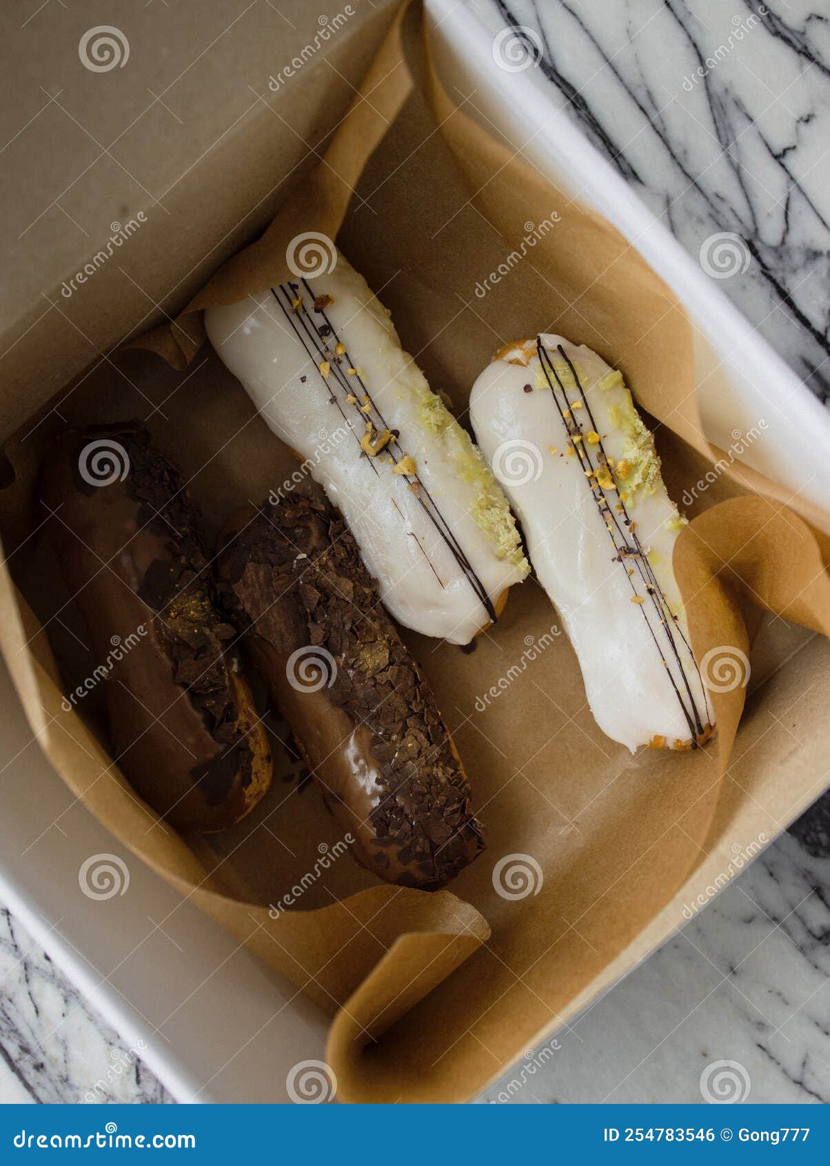 Eclairs in box stock photo. Image of eclair, takeout - 254783546