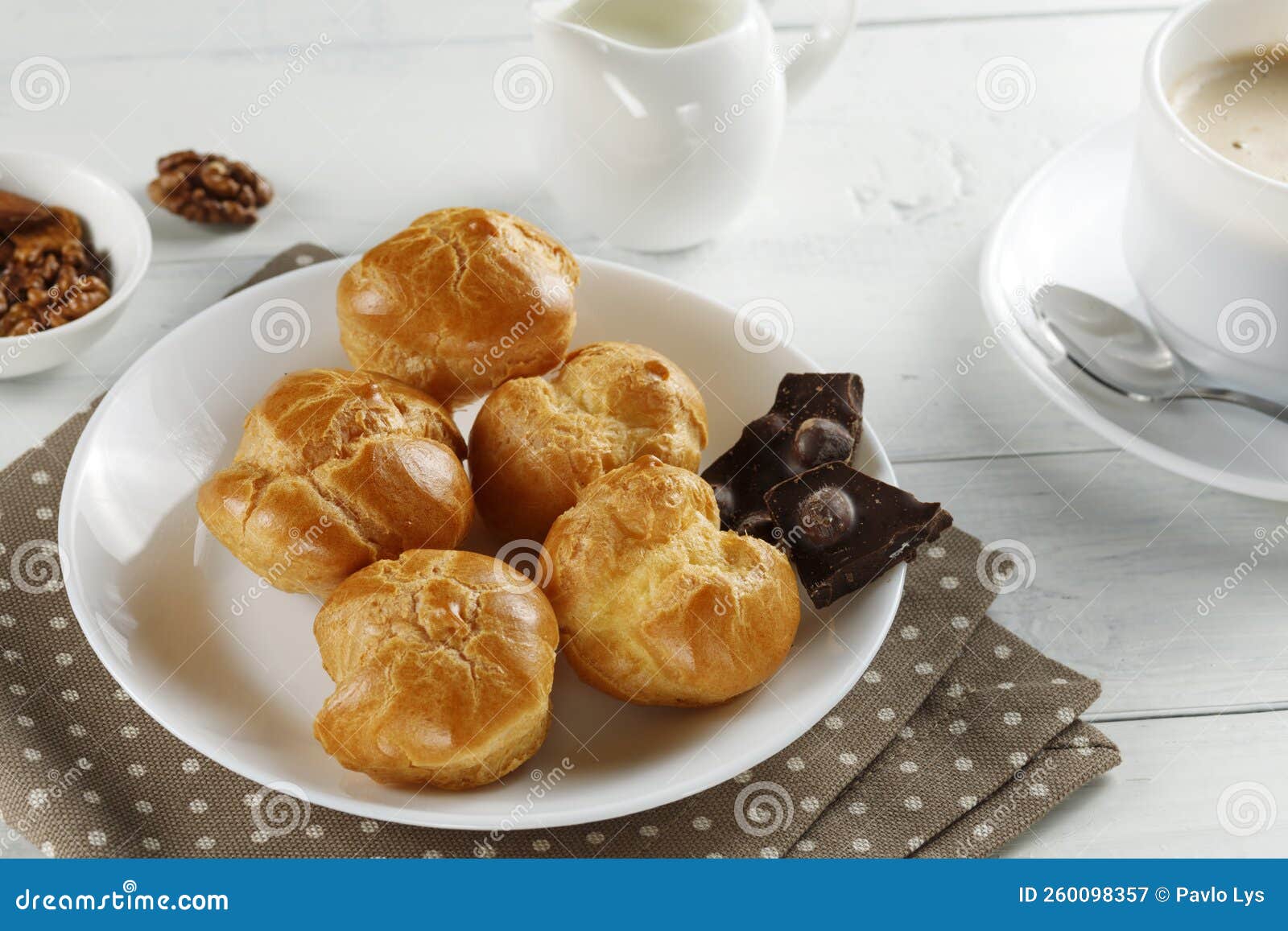 Eclairs with Chocolate, Cappuccino and Milk. Sweet Breakfast Stock ...