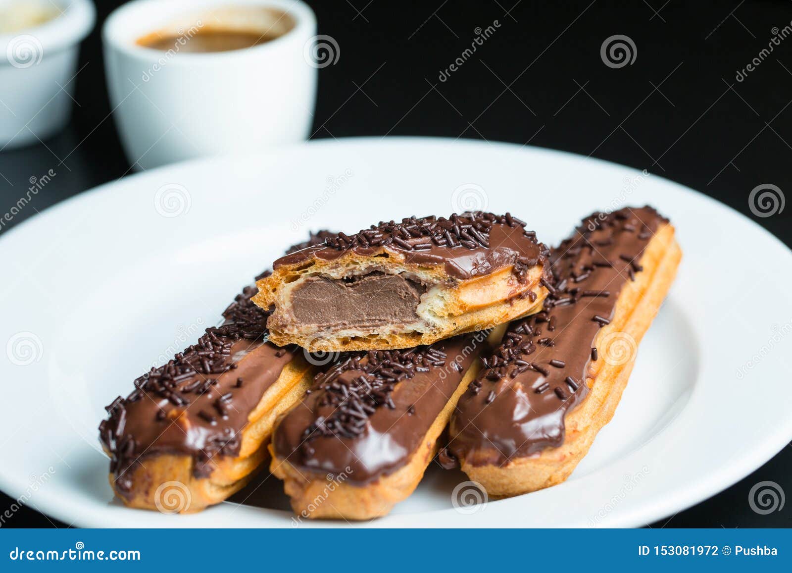 Eclairs with Chocolate Icing on a Plate Stock Photo - Image of colorful ...