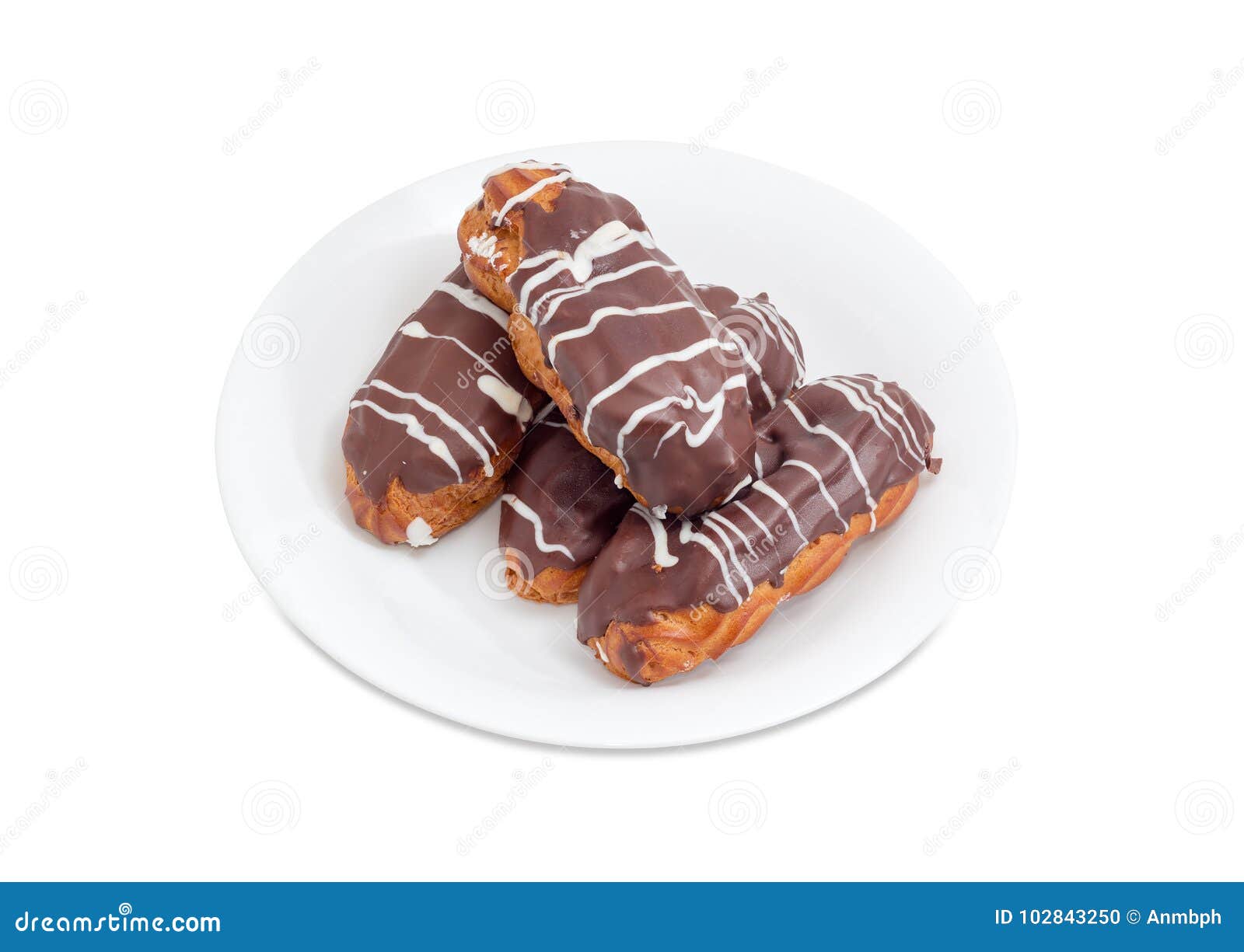 Eclairs with Chocolate Icing on a White Dish Stock Photo - Image of ...