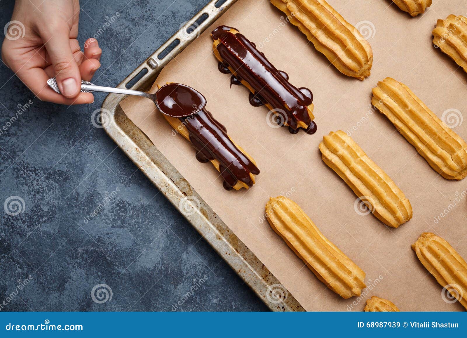 Eclairs with Chocolate and Whipped Cream Preparing on Baking Sheet ...